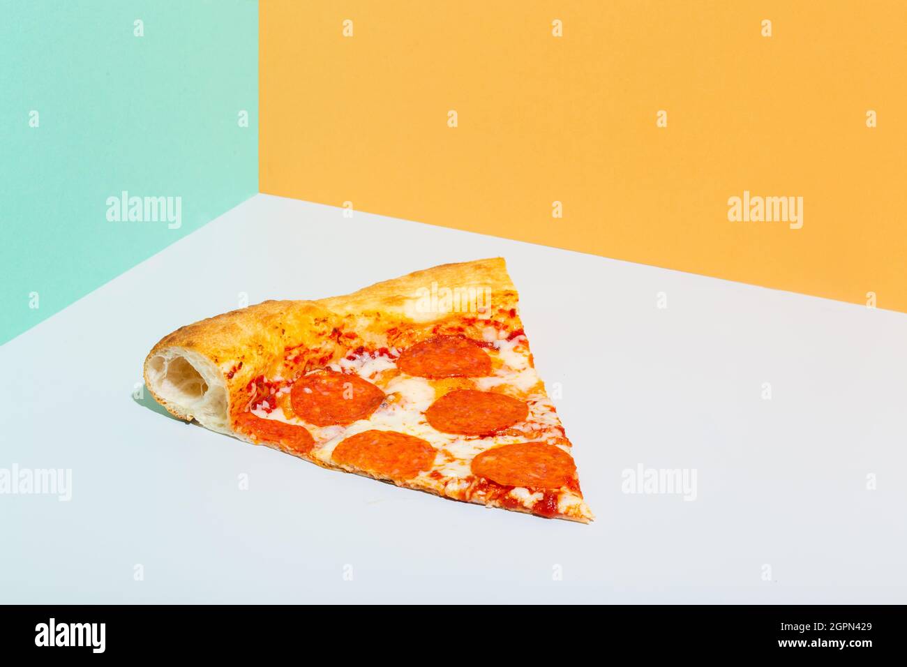 Slice of Pepperoni Pizza orange grey turquoise paper background modern ...