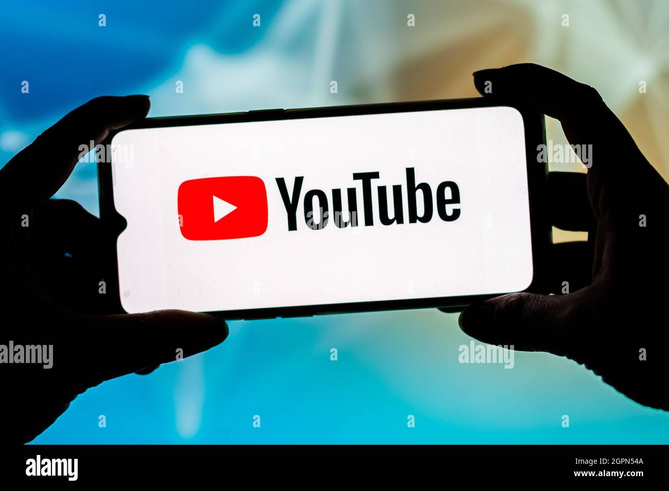 In this photo illustration a YouTube logo seen displayed on a smartphone. (Photo by Mateusz ...