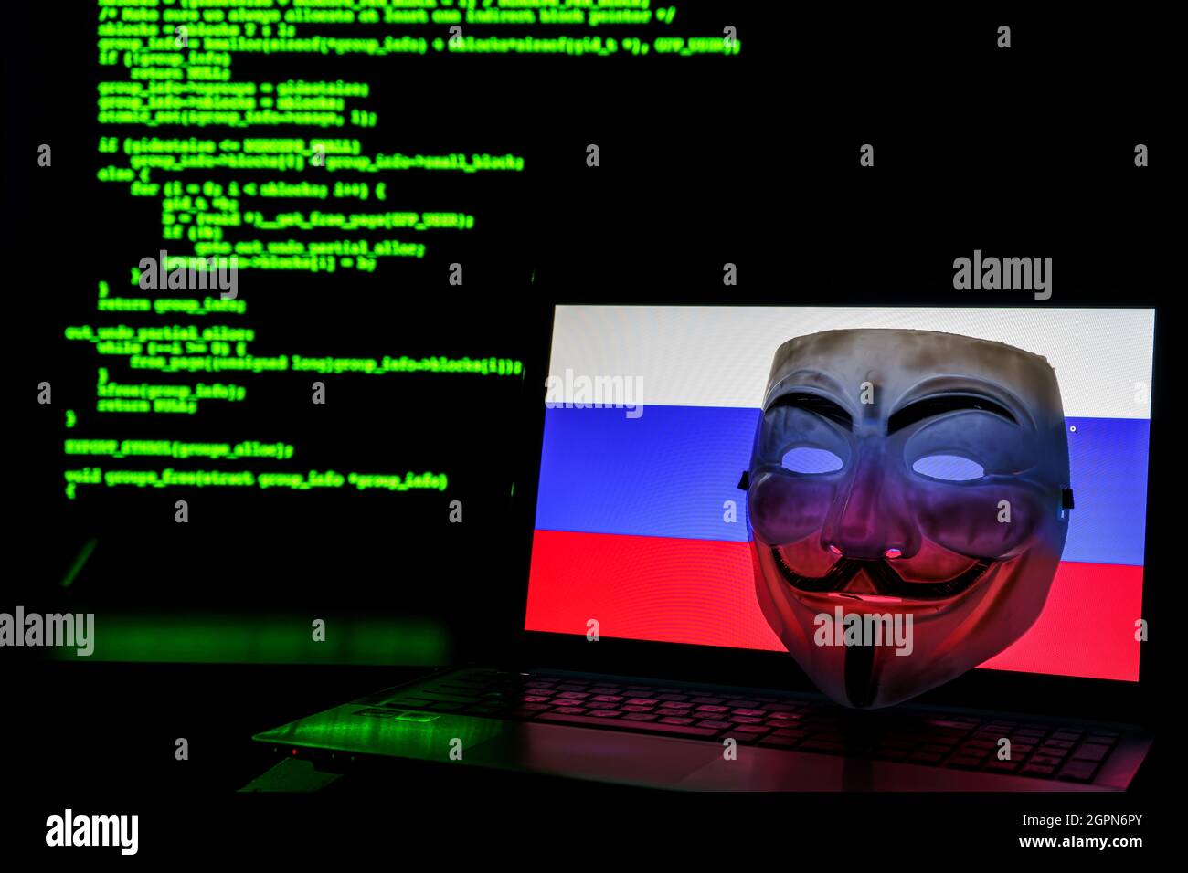 Russian anonymous hackers with vendetta mask. Russian flag and ...
