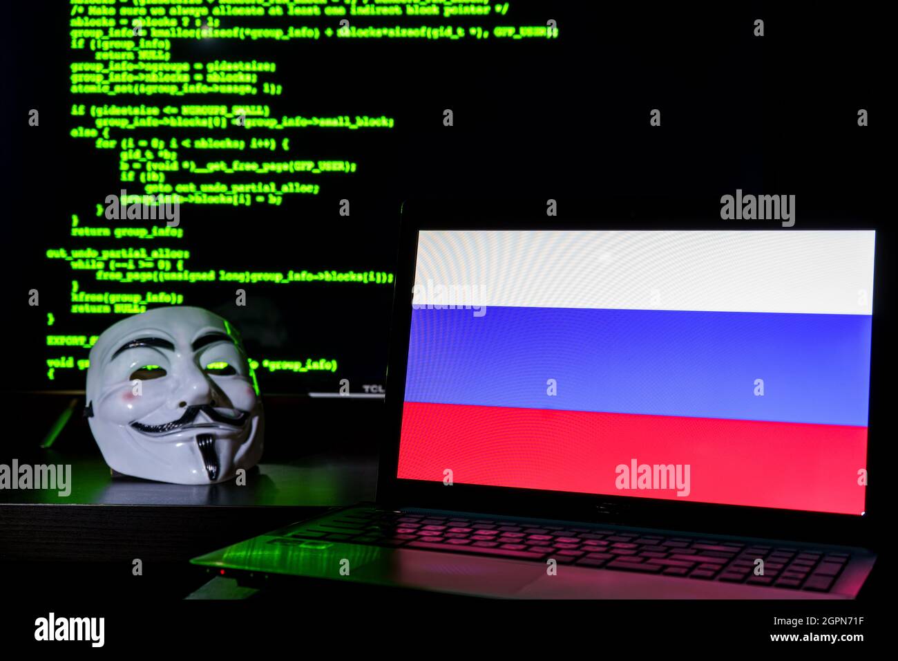 Russian anonymous hackers with vendetta mask. Russian flag and ...