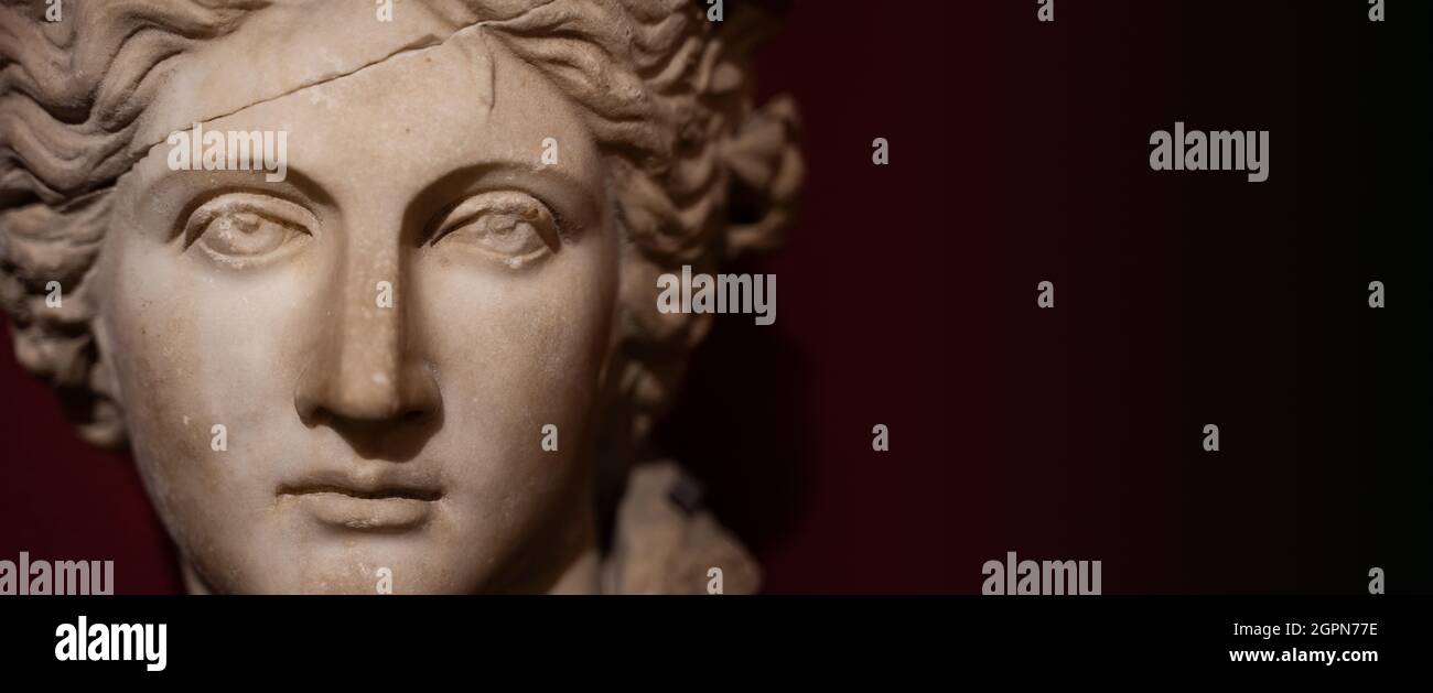 front view closeup of woman antique white marble statue with cracked ...