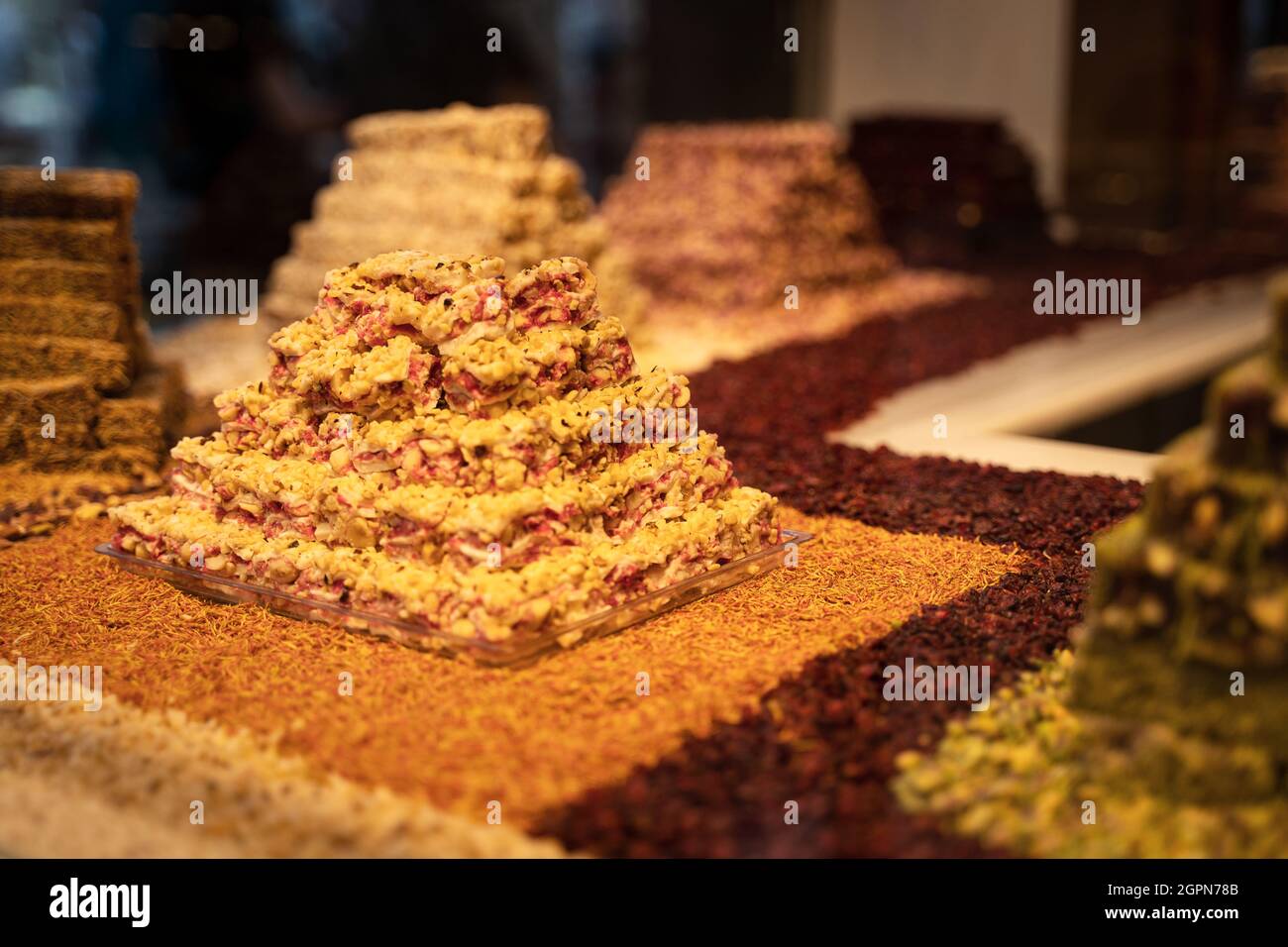 rows of Turkish delight sweets desserts with dried fruits arranged in a ...
