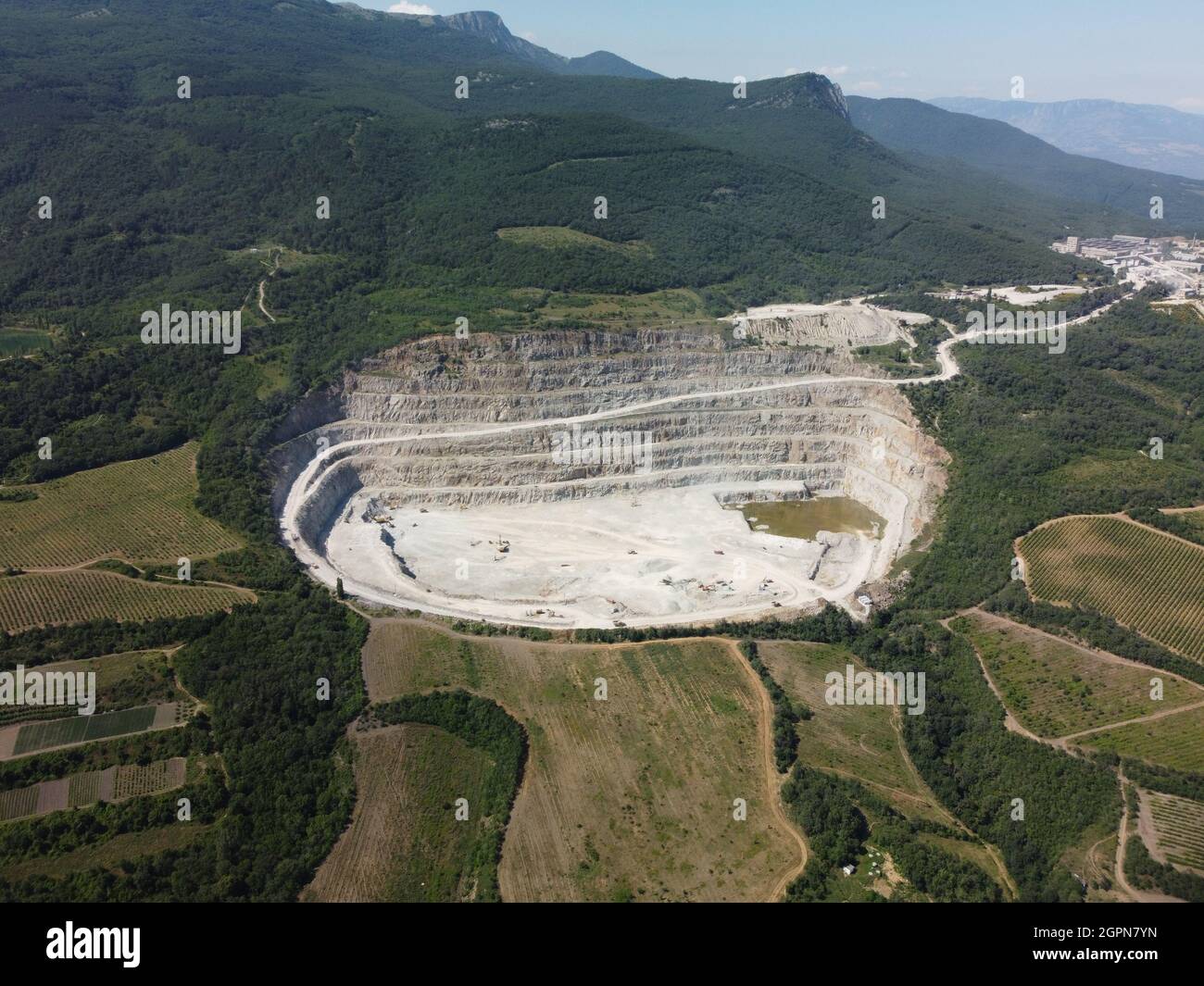 Aerial view industrial of opencast mining quarry with lots of machinery ...
