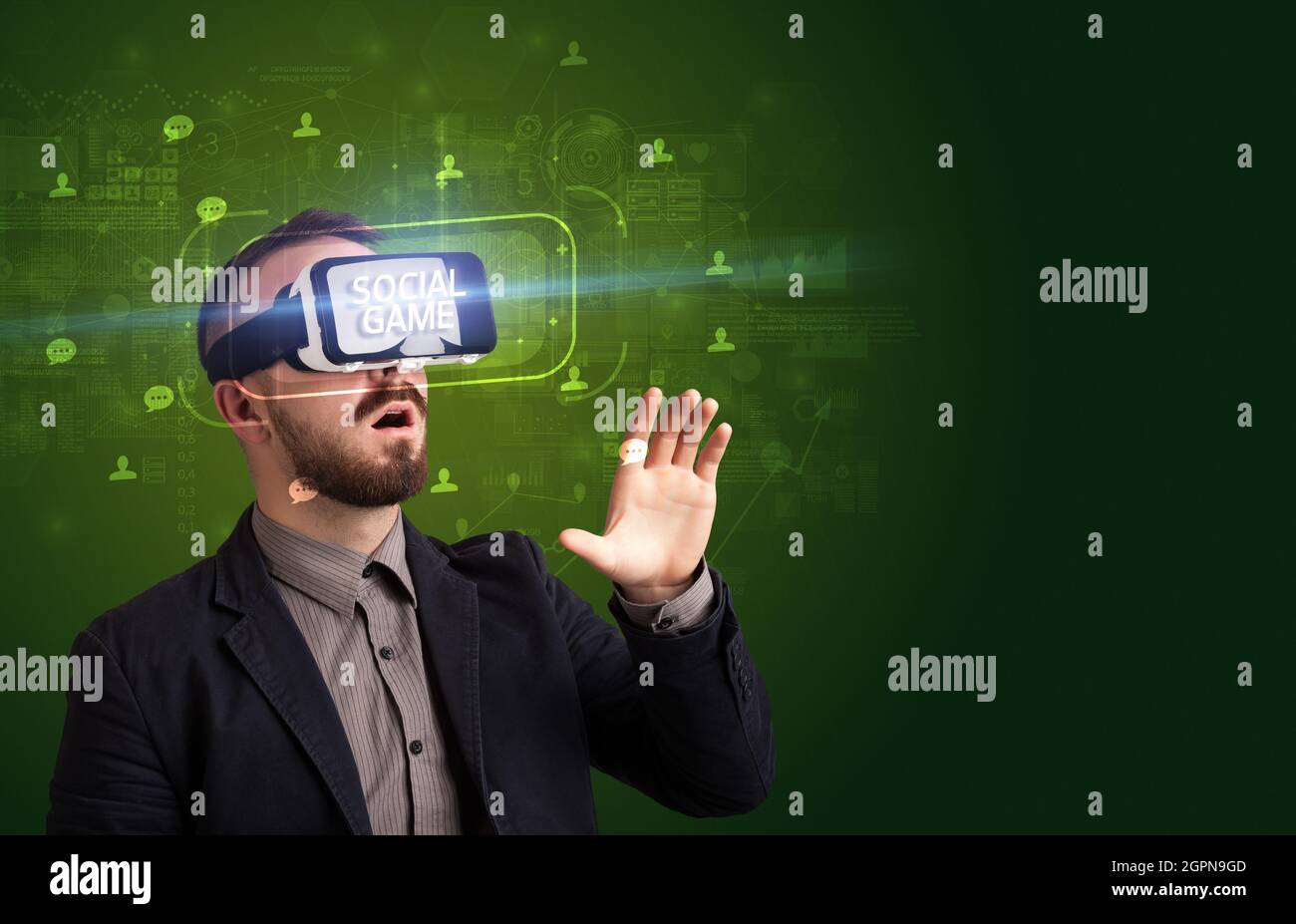 Businessman looking through Virtual Reality glasses, social media ...