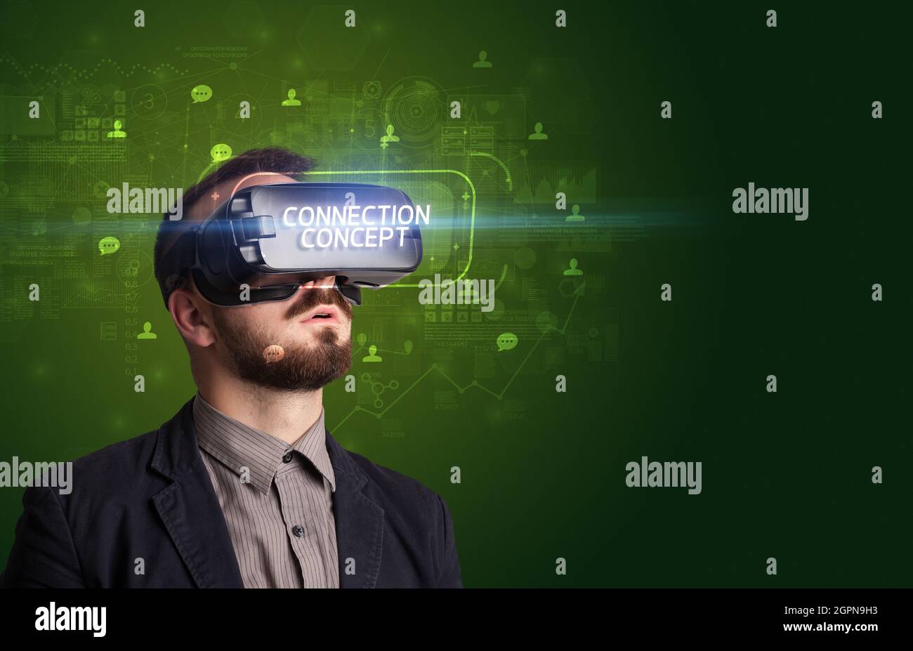 Businessman looking through Virtual Reality glasses, social media ...