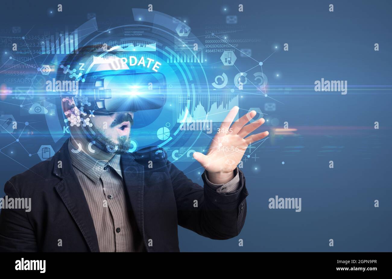 Businessman looking through VR glasses Stock Photo - Alamy