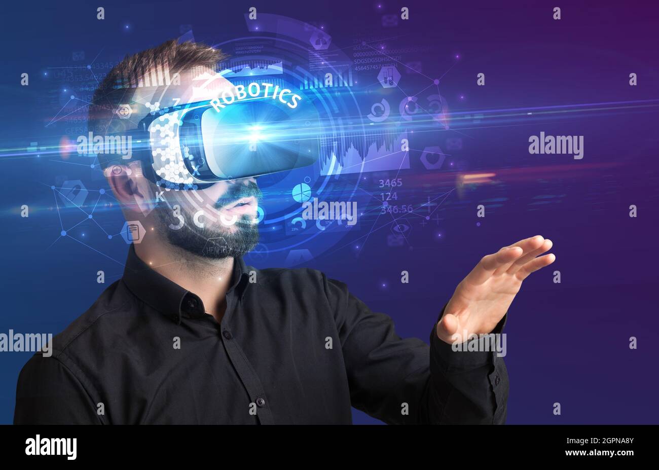 Businessman looking through VR glasses Stock Photo - Alamy