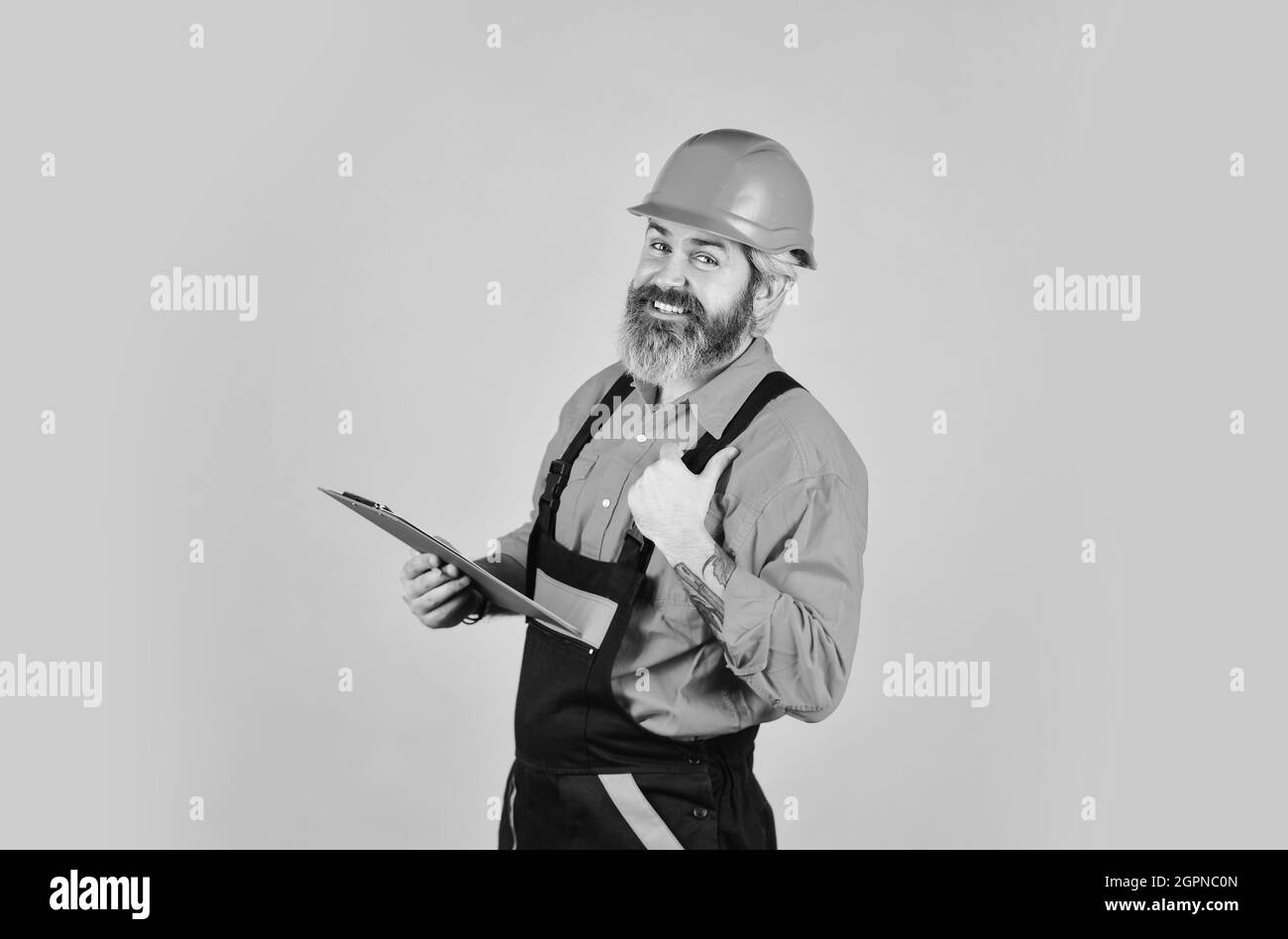 home concept. under construction. builder with data folder. worker with ...