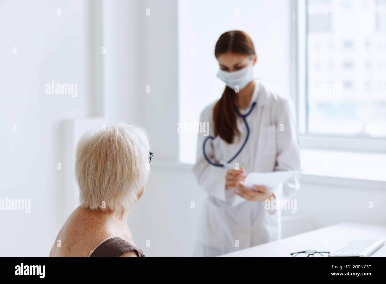 female doctor patient examination health care Stock Photo - Alamy