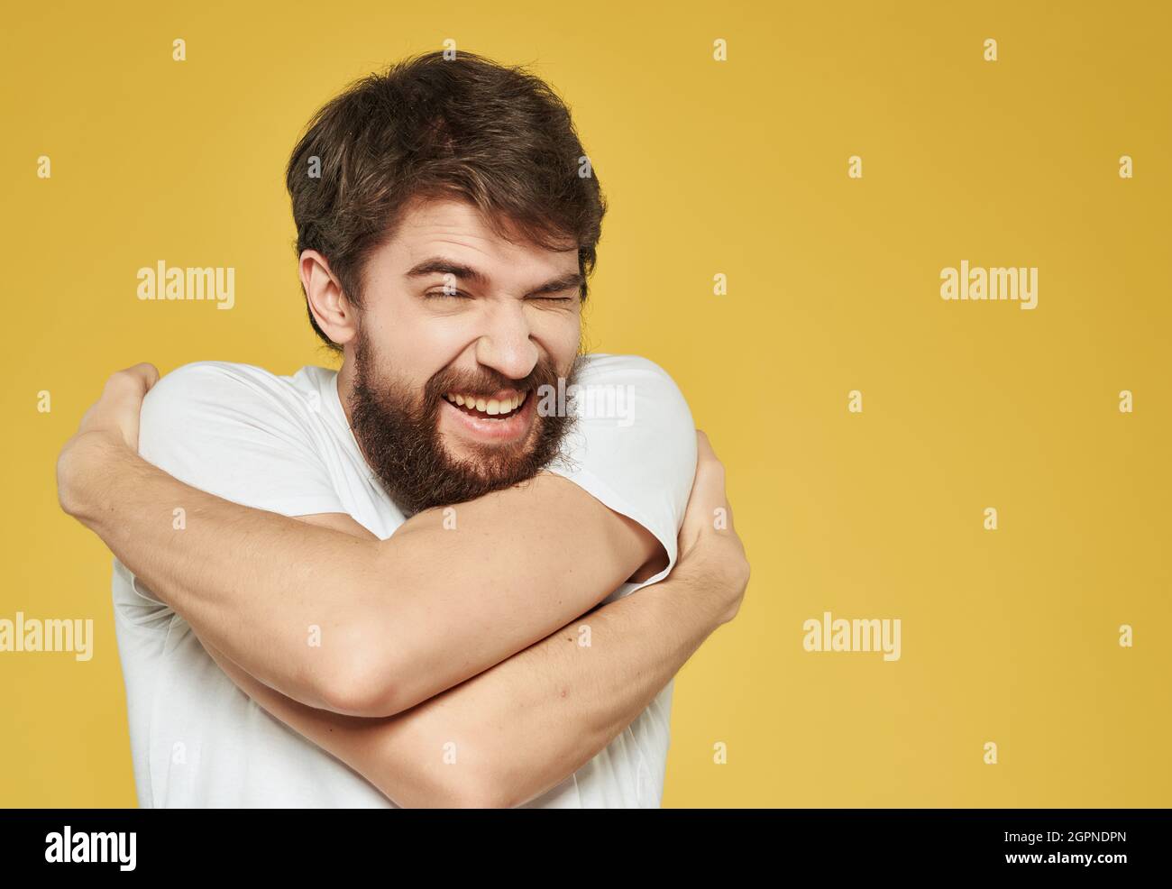bearded man in a white t-shirt hand gestures anger close-up Stock Photo ...