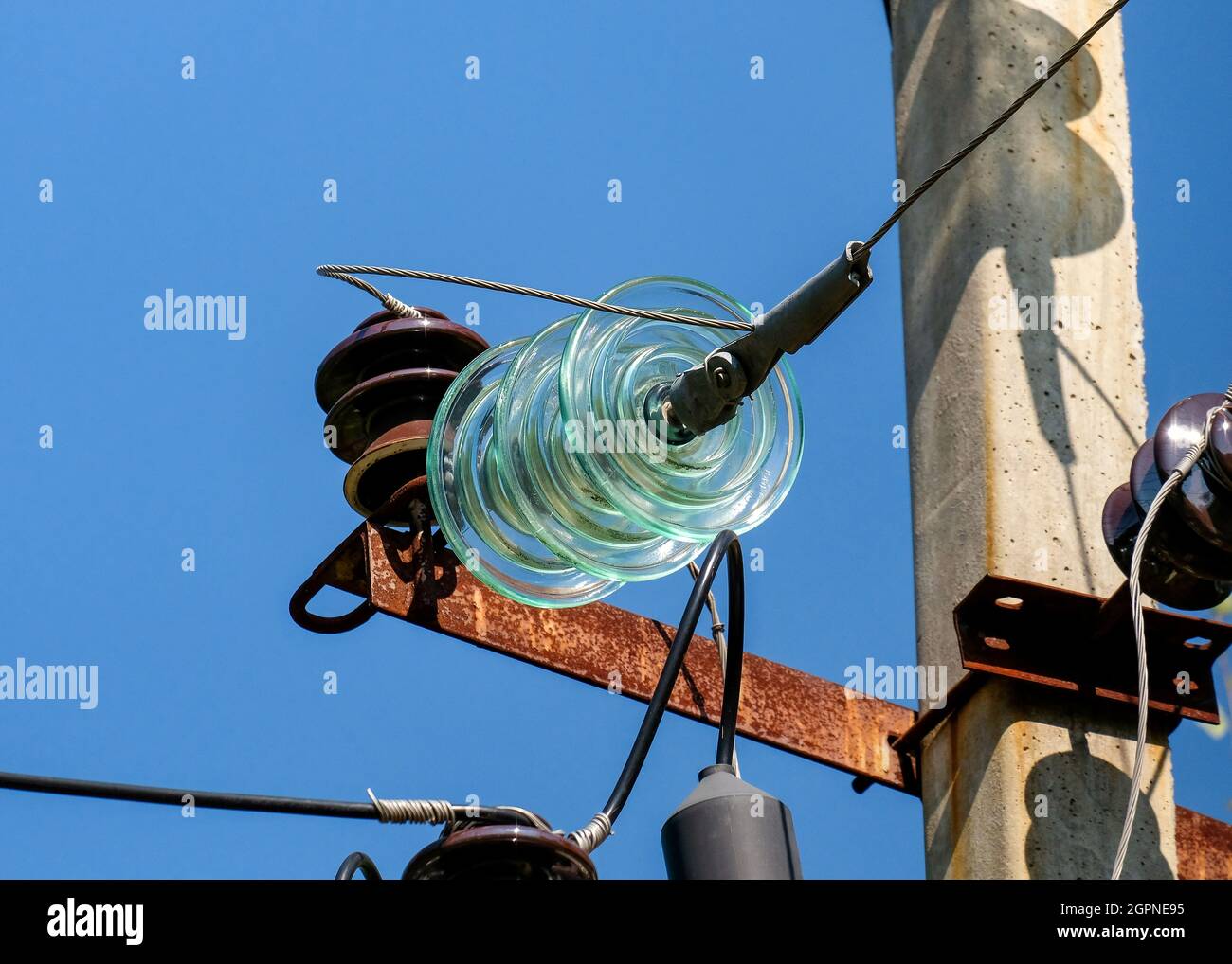 Installation of electrical networks on a concrete pillar Stock Photo ...