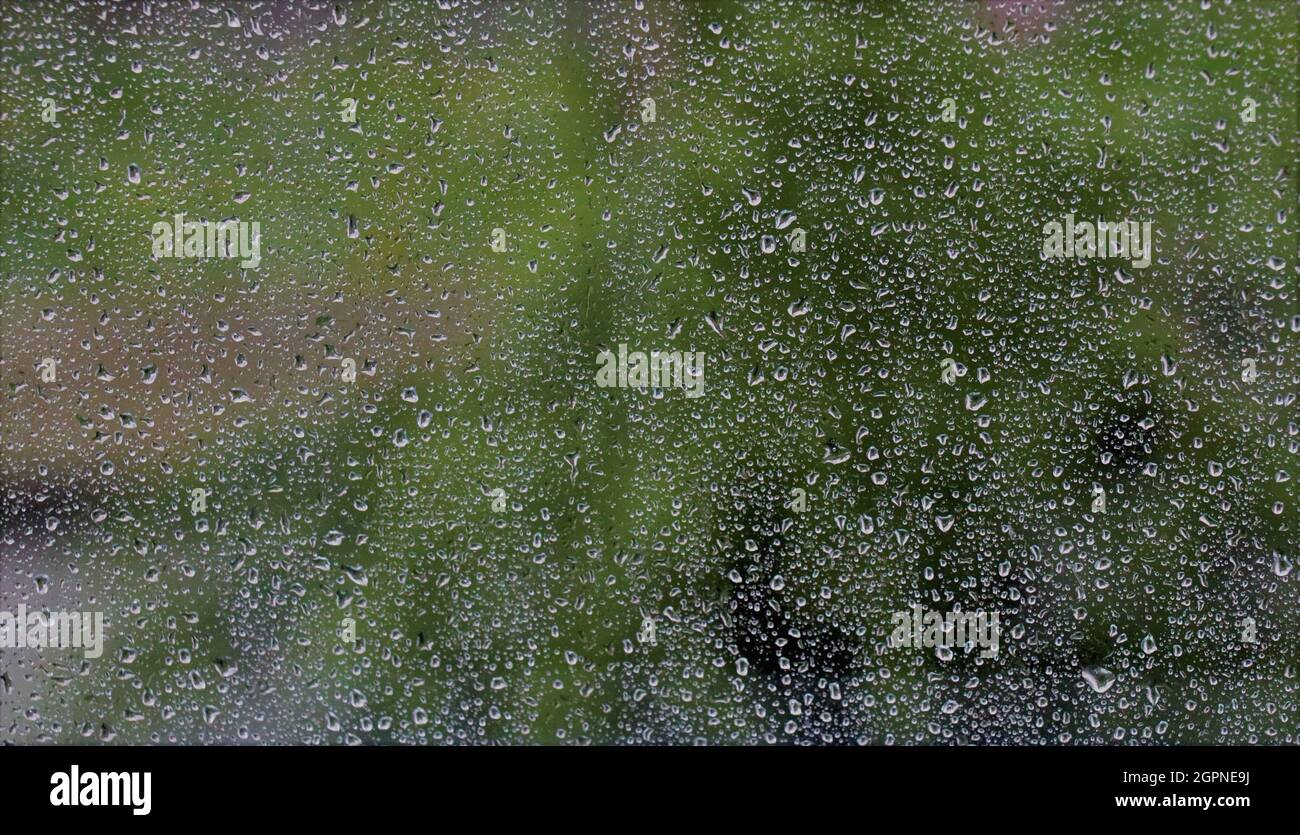 Rain drops running down window hi-res stock photography and images - Alamy