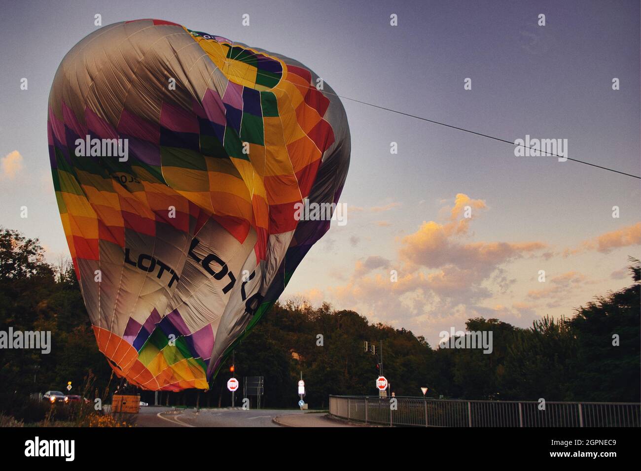 Balloon landing with gas floating out of it Stock Photo - Alamy
