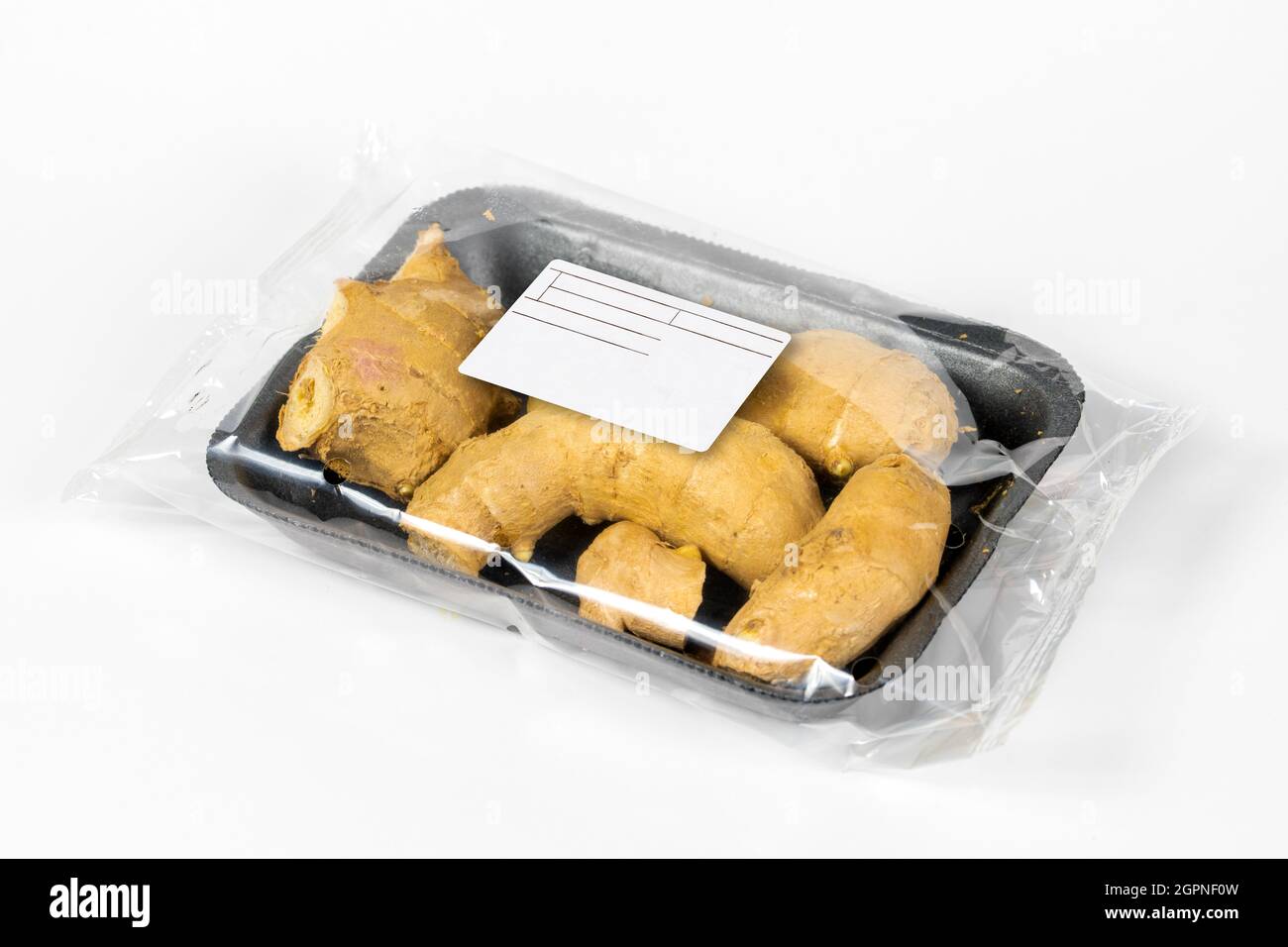 Freshly harvested ginger in a labeled pack on white background Stock ...