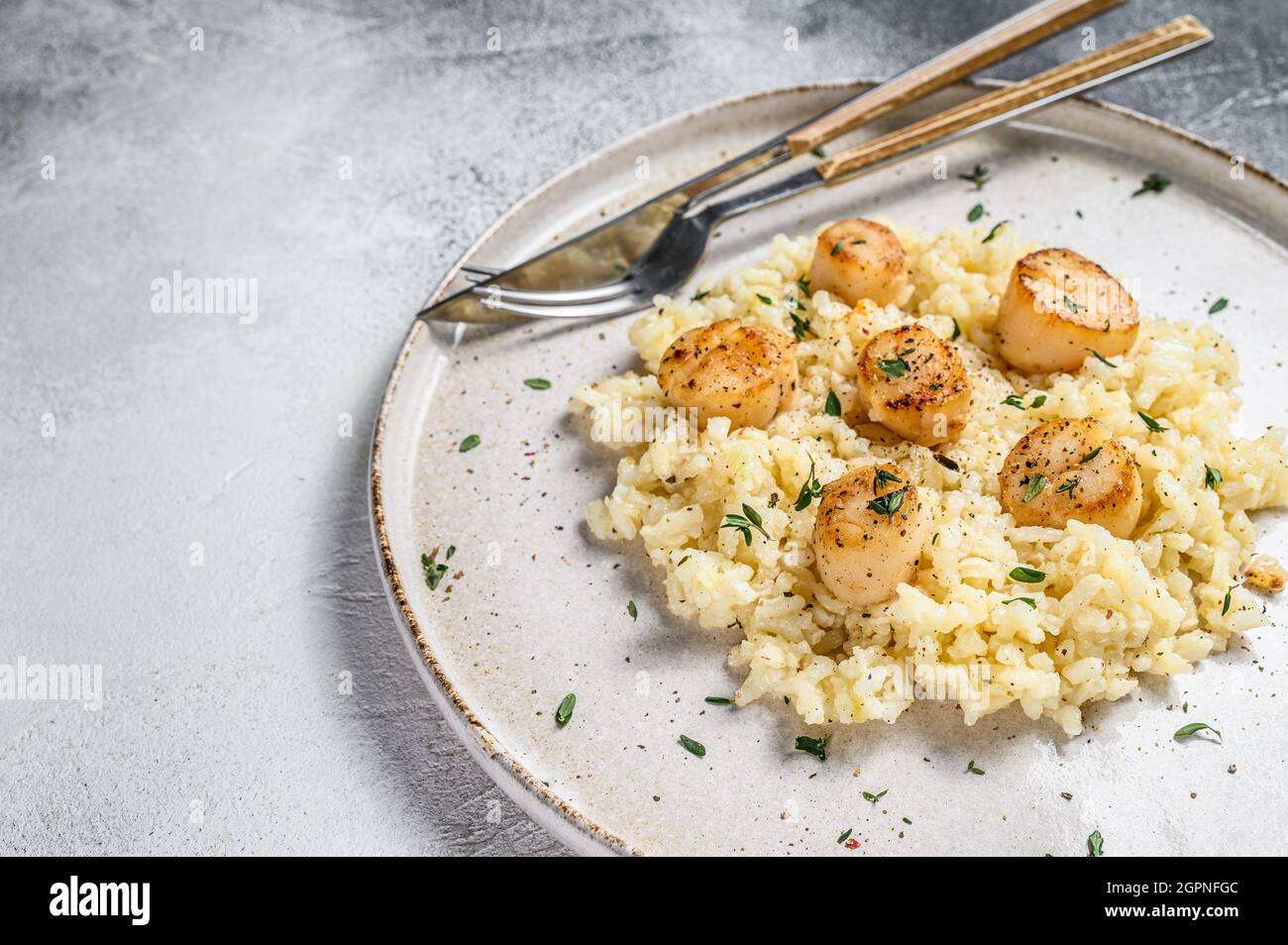Italian Risotto with pan seared sea scallops. White background. Top ...