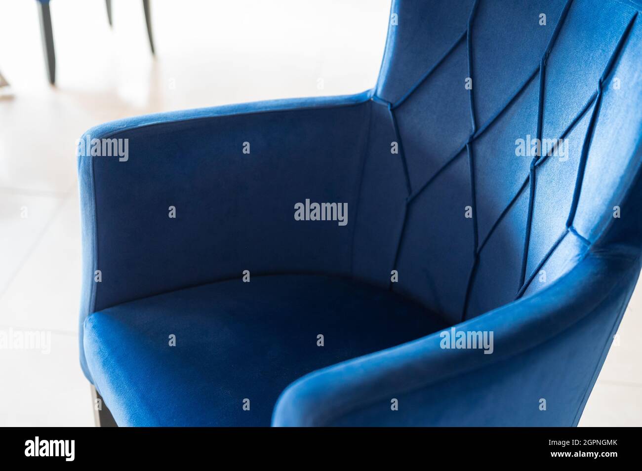 Stylish blue chair, close up. Textile chair Stock Photo - Alamy