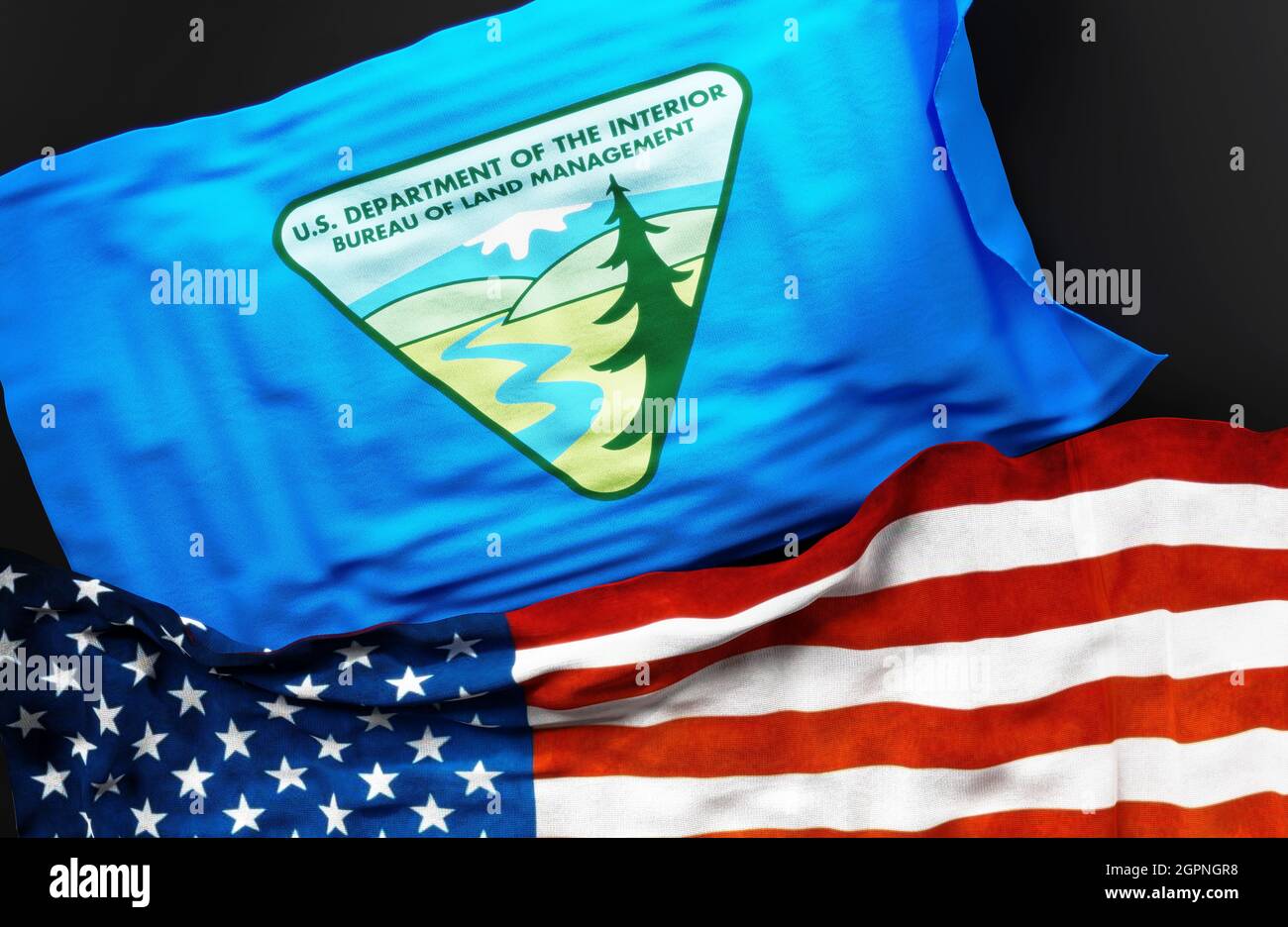 Flag of the United States Bureau of Land Management along with a flag ...