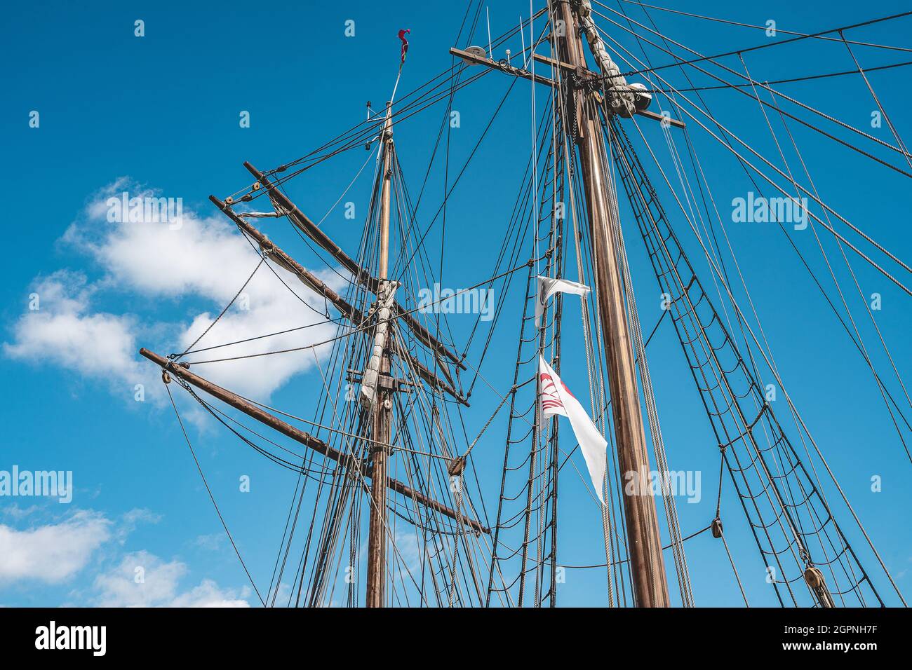 Mast of a sail ship with the danish flag, in the harbor of Copenhagen ...