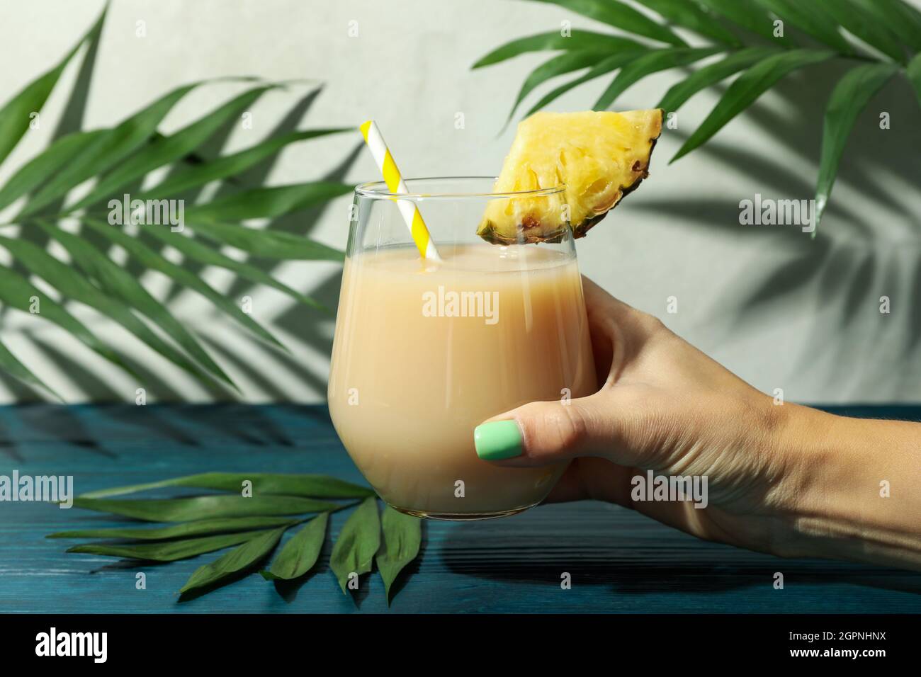 Female hand holds pina colada cocktail, close up Stock Photo - Alamy