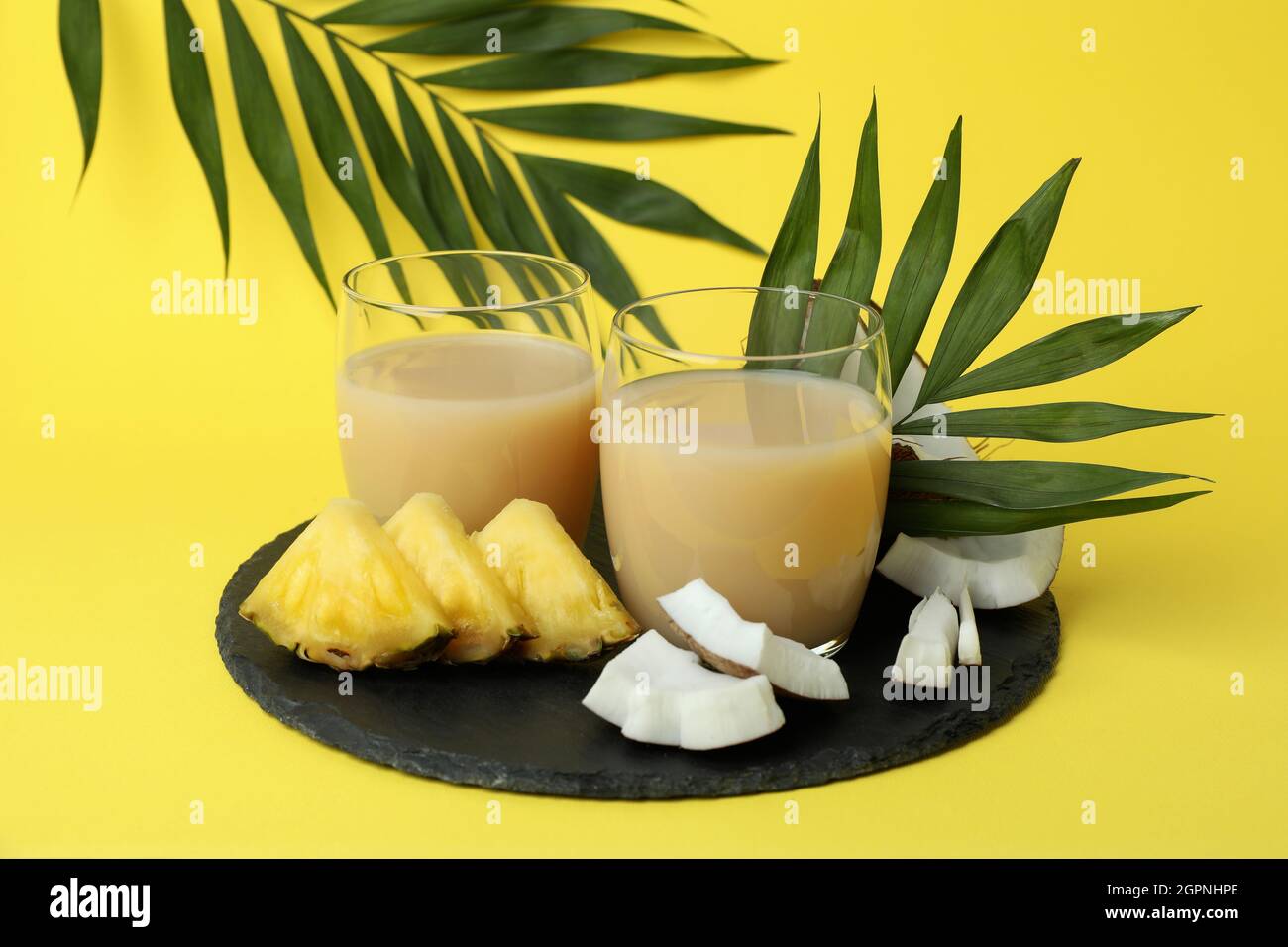 Pina colada cocktails and ingredients on yellow background Stock Photo ...