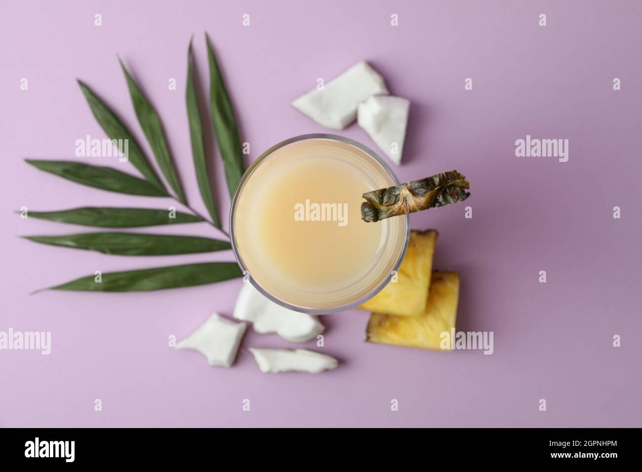Pina colada cocktail and ingredients on violet background Stock Photo ...