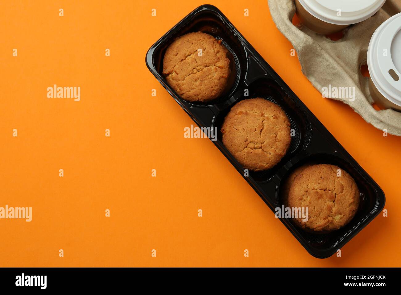 Woman eating cookies drinking coffee hi-res stock photography and ...