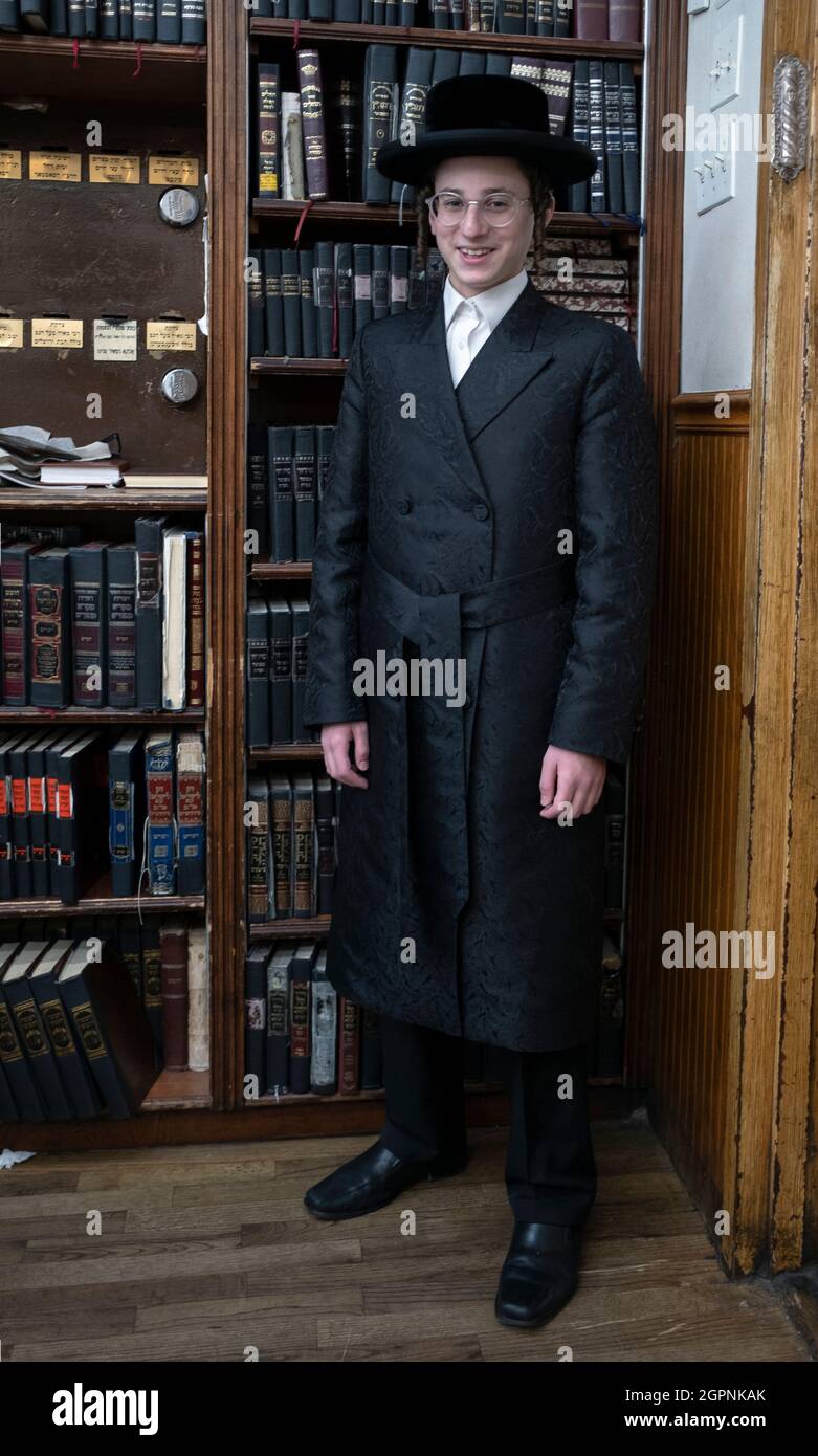 Posed portrait of a Hasidic Jewish teenager in a synagogue in ...