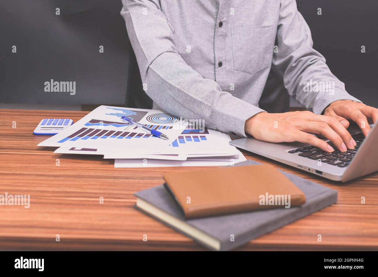 Business people sit at work and check documents At the desk in the room ...