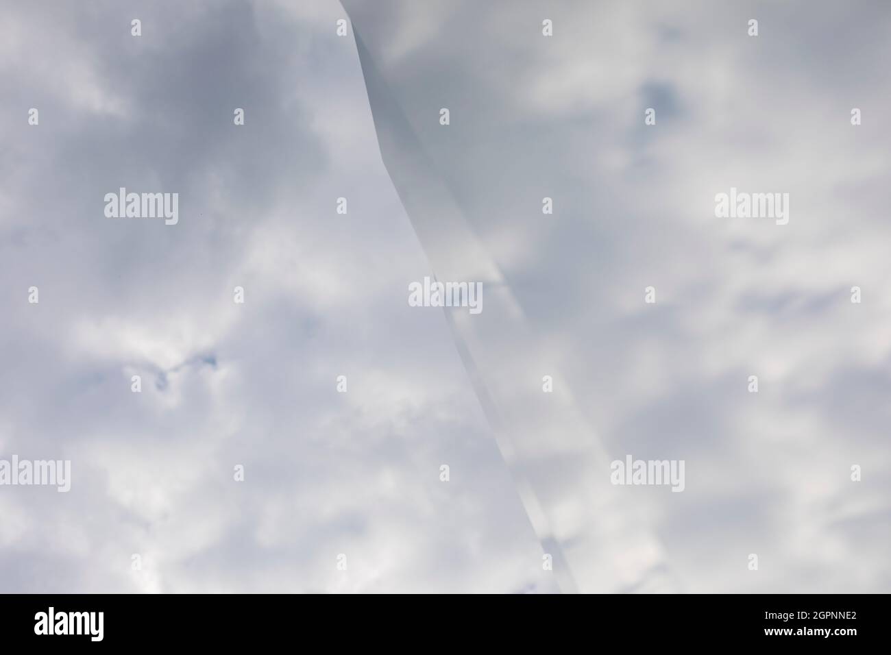 The texture of the sky reflected in the mirror. Clouds distorted by a ...