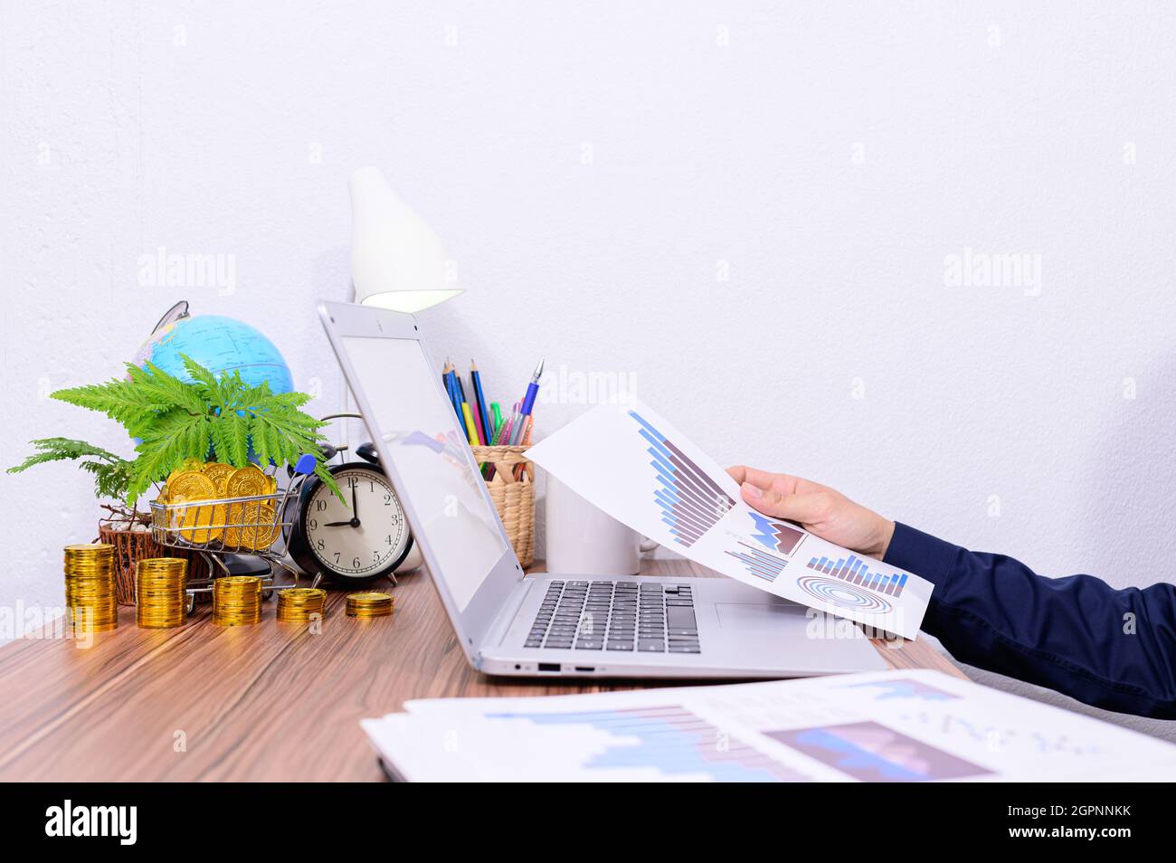 Business people examine growth papers With computer Stock Photo - Alamy