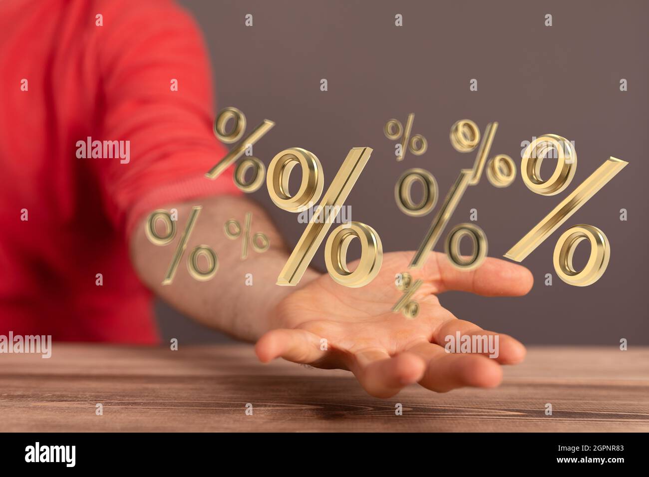 Closeup shot of 3d rendered percent signs in man's hand -Interest rate ...