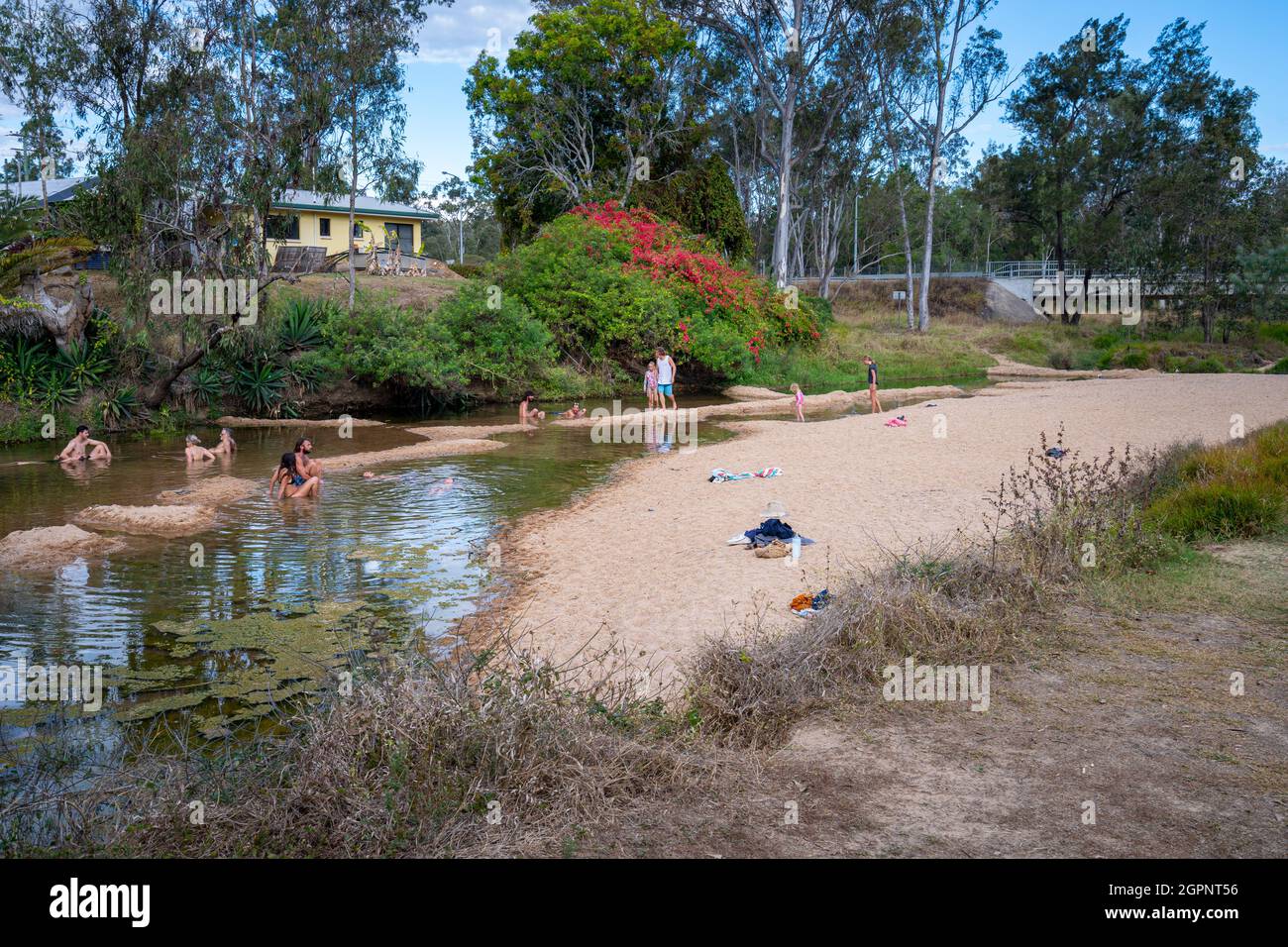 Tourists relaxing in the shallow hot water pools at Innot Hot Springs ...