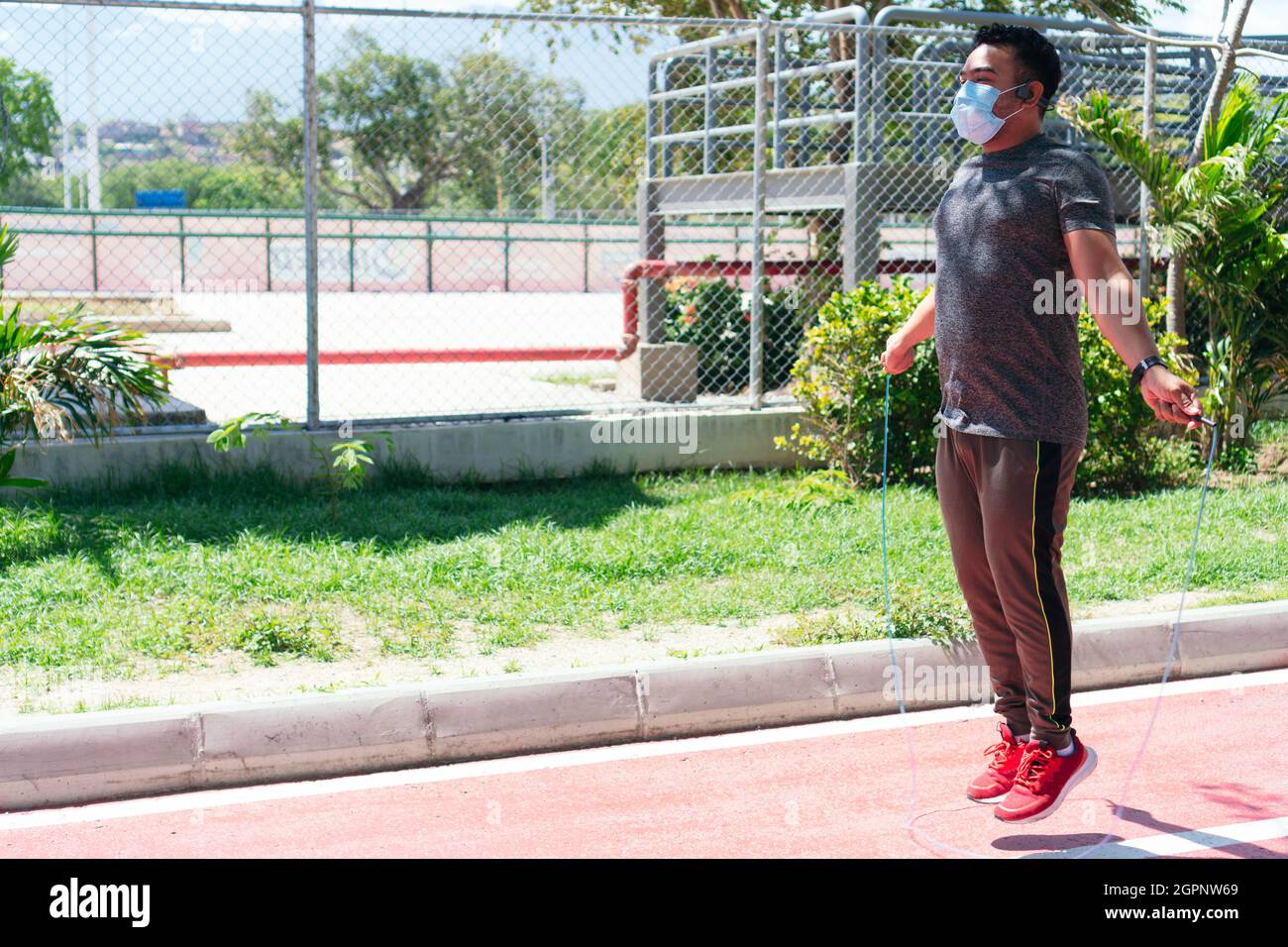 Image of a handsome young athlete jumping rope in the street Stock ...