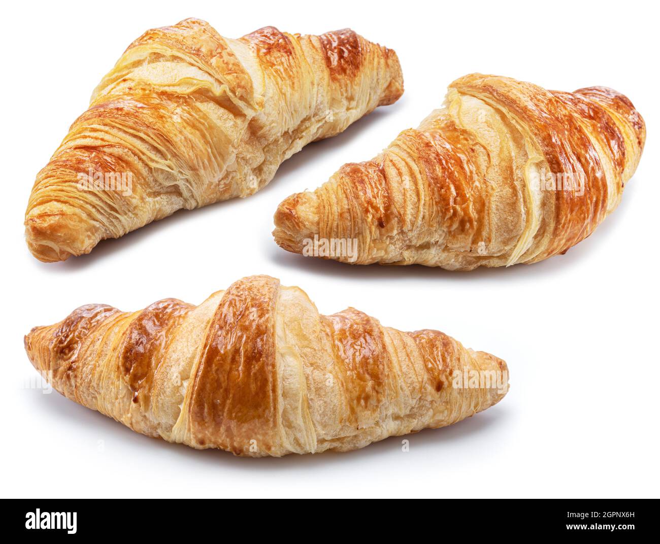 Three croissants on white background. Top view Stock Photo - Alamy