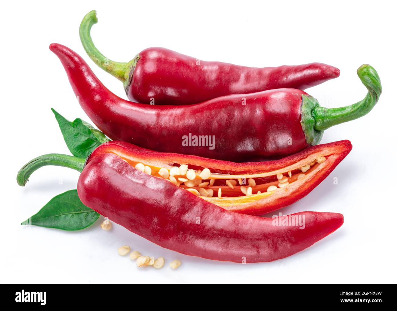 Fresh red chilli pepper and cross sections of chilli pepper with seeds ...