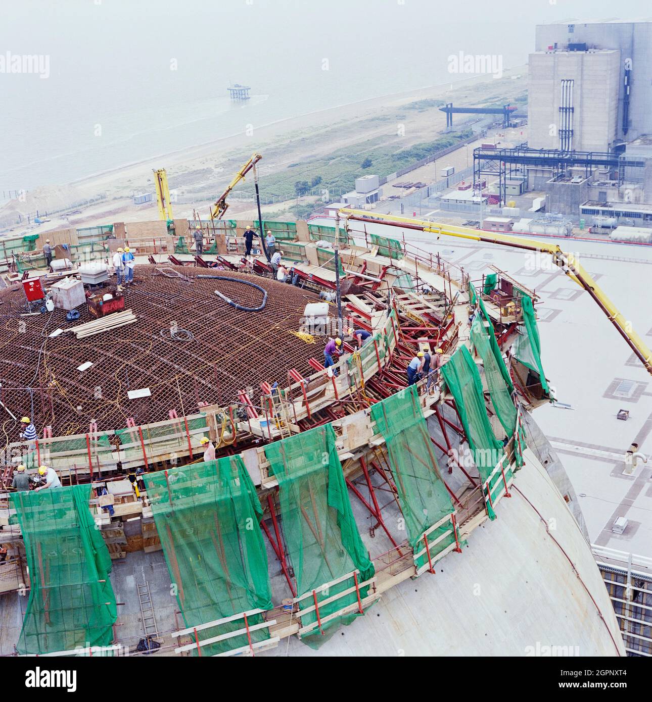 Laing workers concreting the top of the reactor dome during the ...