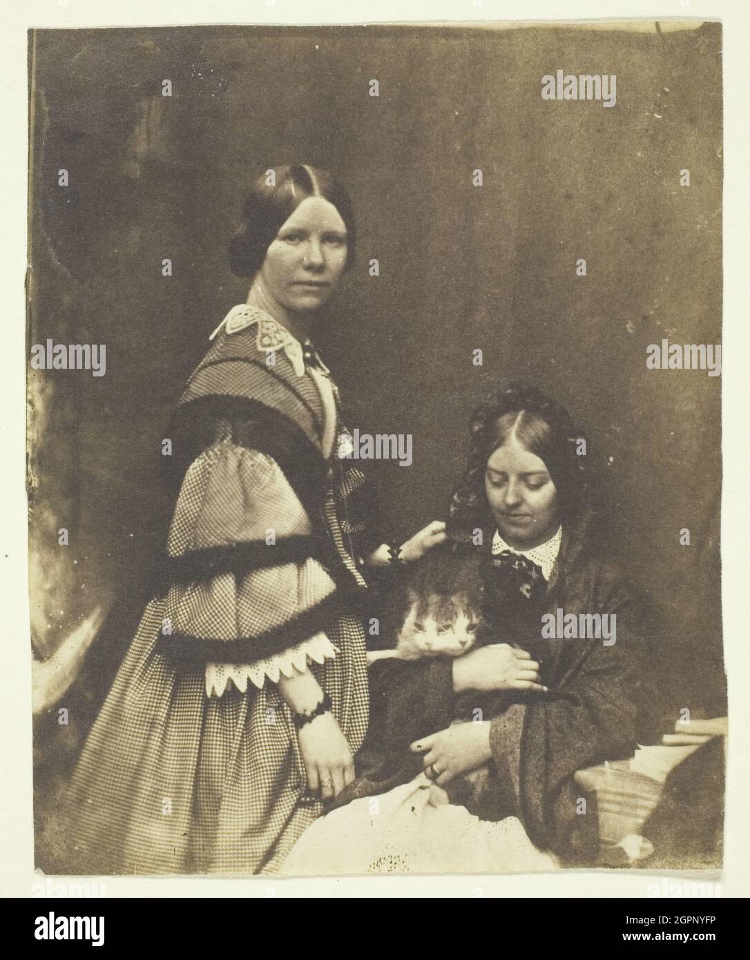 Mrs. Craik [right] Holding Cat, c. 1858. [Portrait of British novelist ...