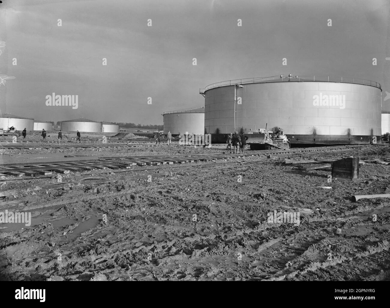 An oil tank being 'skidded' along tracks by two Caterpillar D8 tractors ...