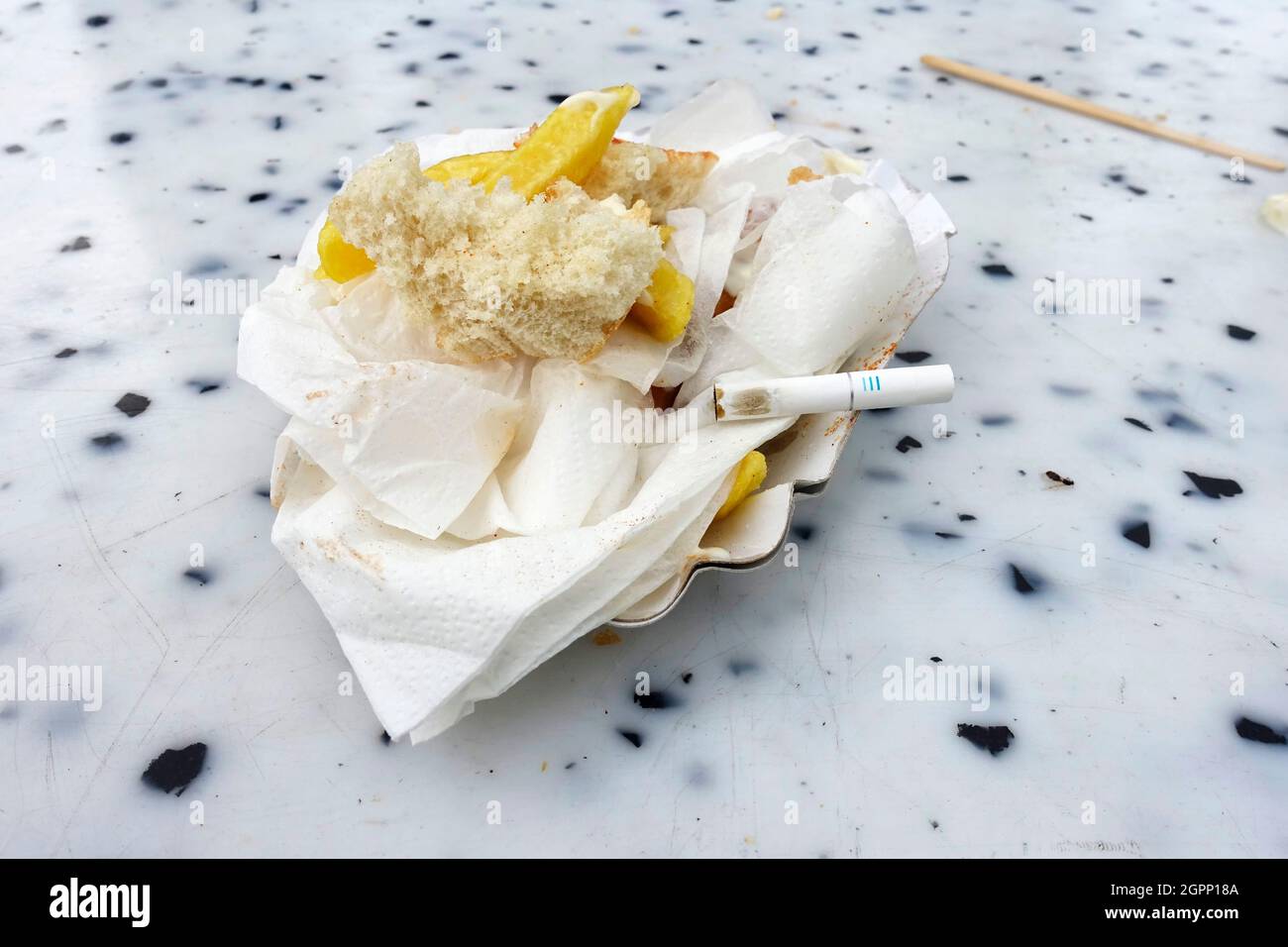 Cigarette put out on food, symbolic image of bad manners Stock Photo ...