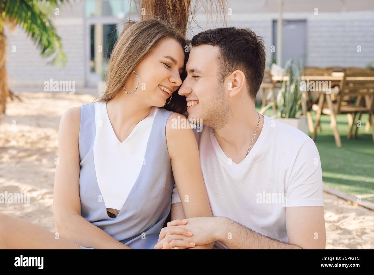 Happy couple in tropical hotel on their honeymoon. Recreation and ...