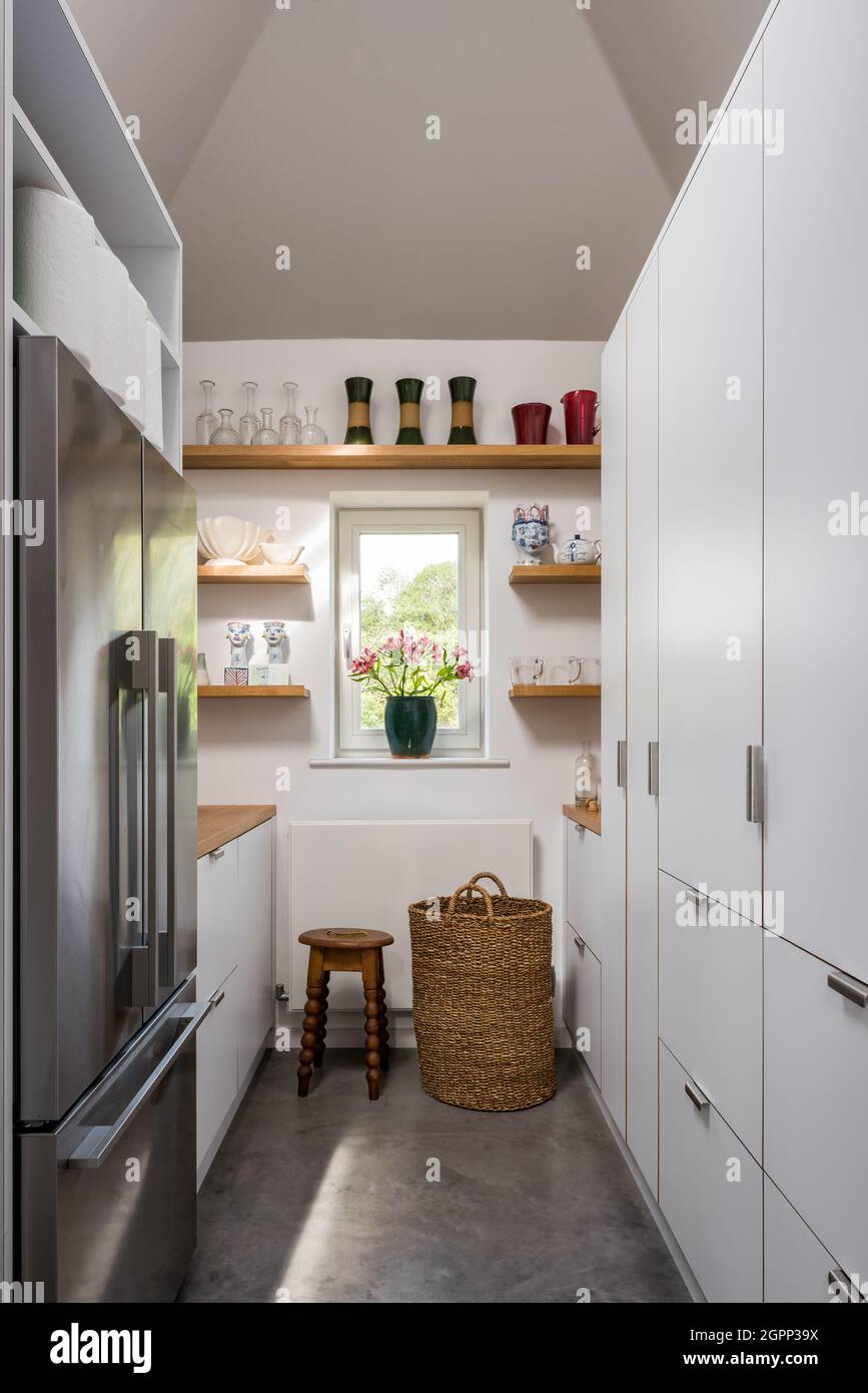Narrow larder with open shelves in Sussex farmhouse, UK Stock Photo - Alamy