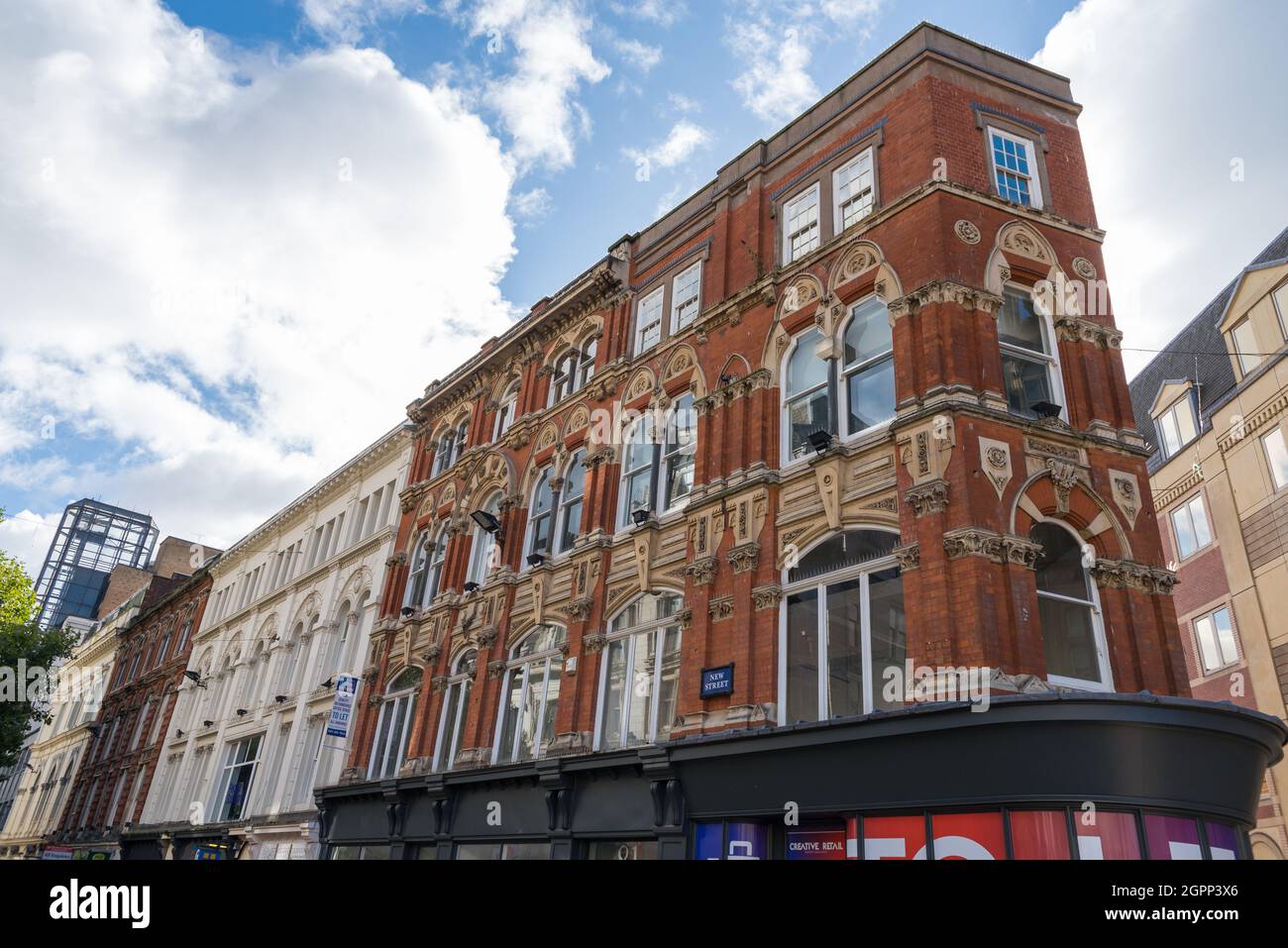 Narrow decorative red brick building on the corner of New Street and ...