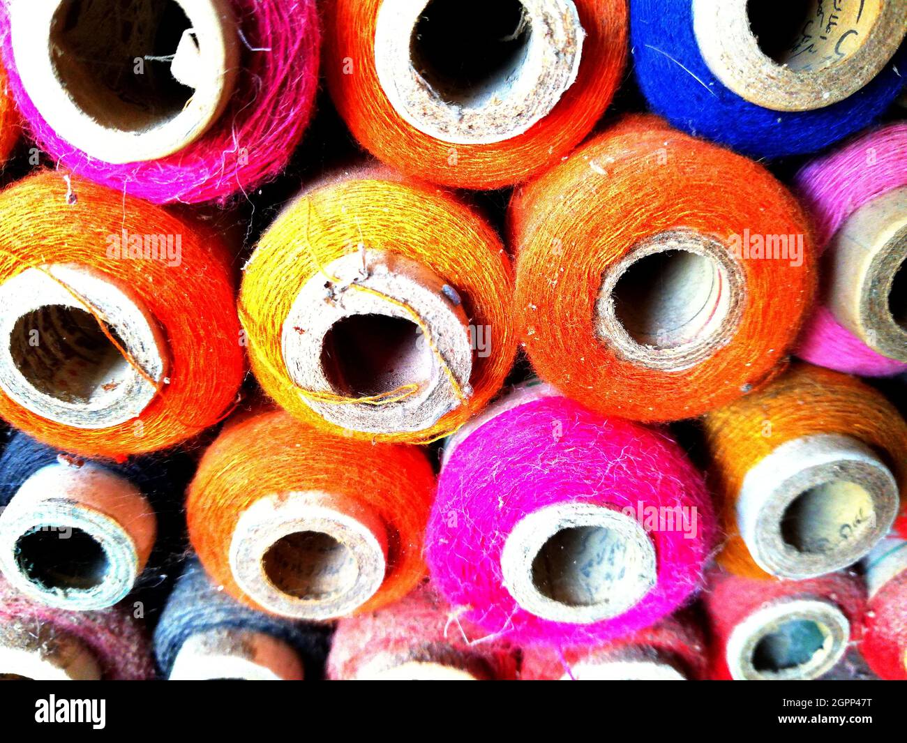 A shop display of colored sewing thread cone Stock Photo - Alamy