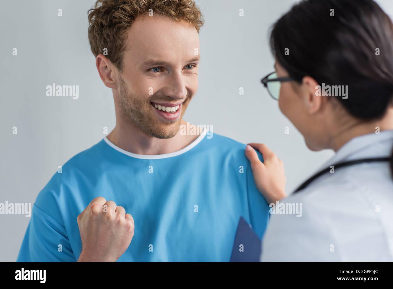 Excited patient looking doctor hi-res stock photography and images - Alamy
