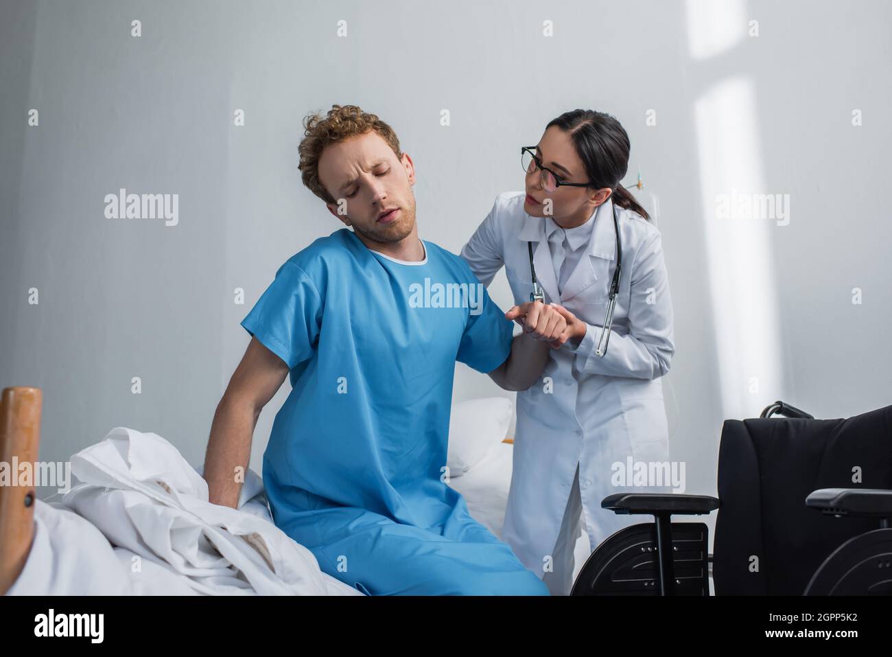 Man and hospital gown and wheelchair hi-res stock photography and ...