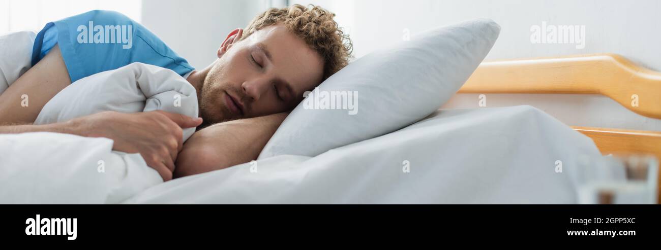 curly patient sleeping in hospital bed, banner Stock Photo - Alamy