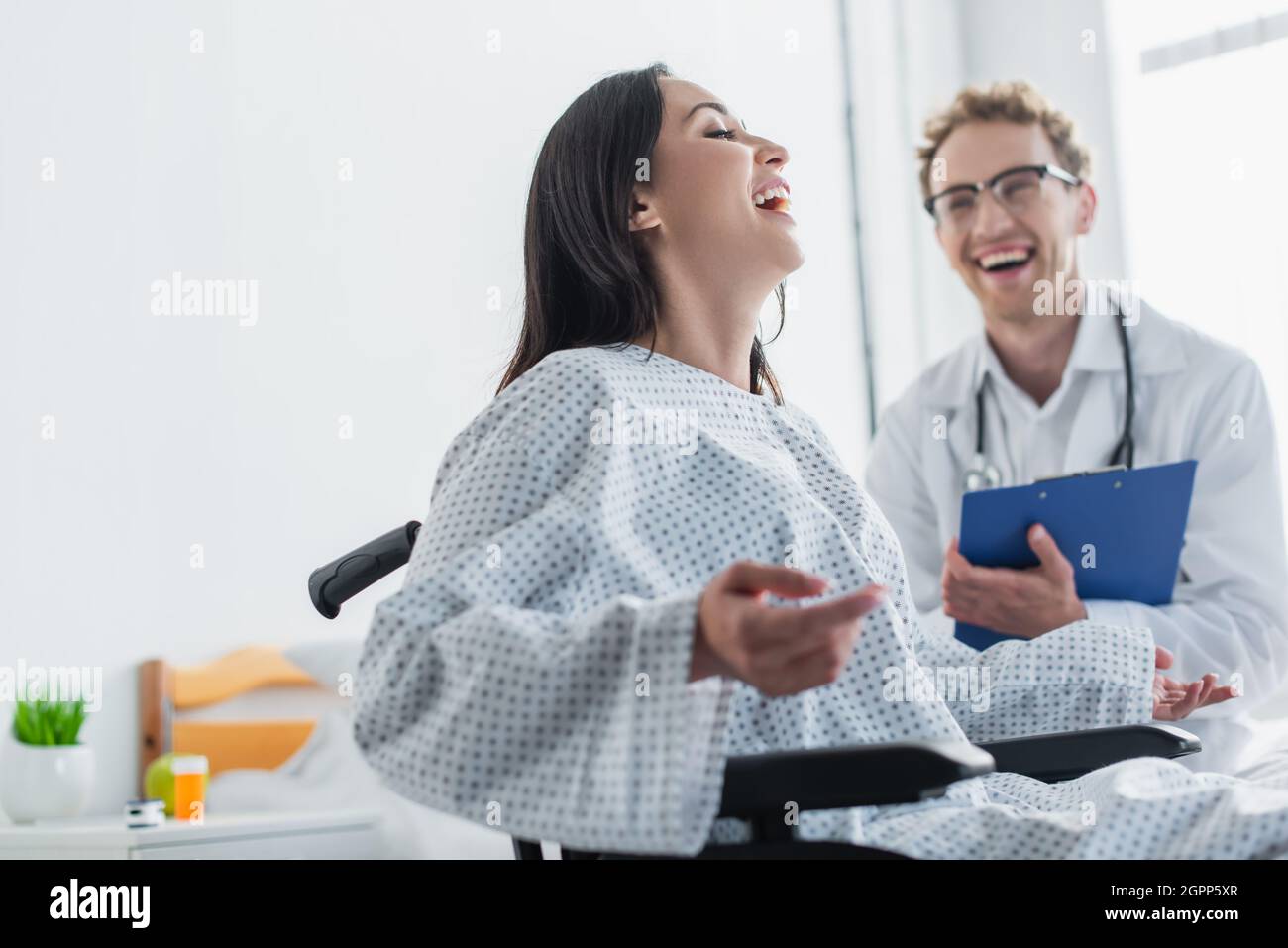 Young doctor laughing with patient hi-res stock photography and images ...