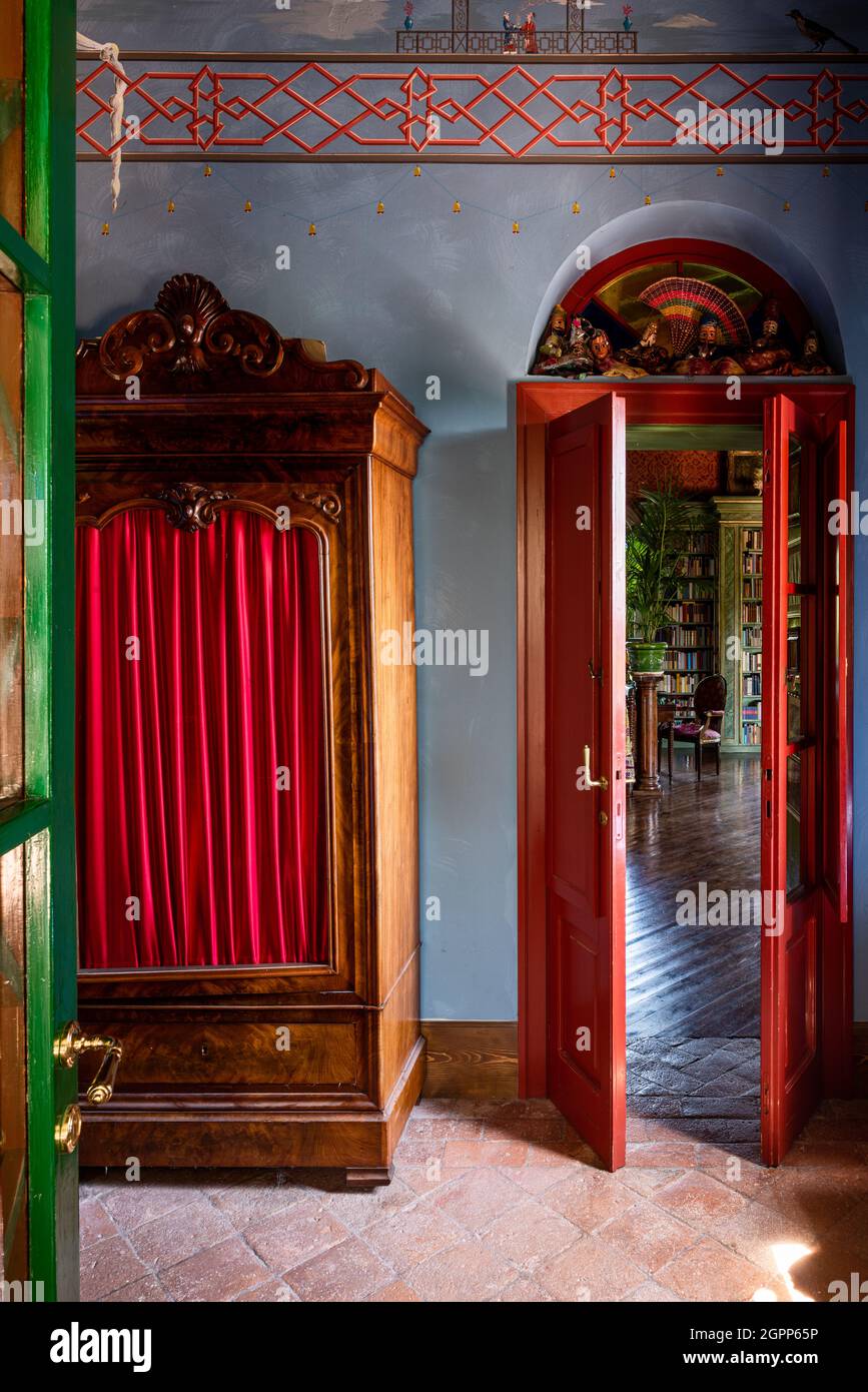 Hand-painted geometric frieze with antique wooden furniture, Lake Garda ...