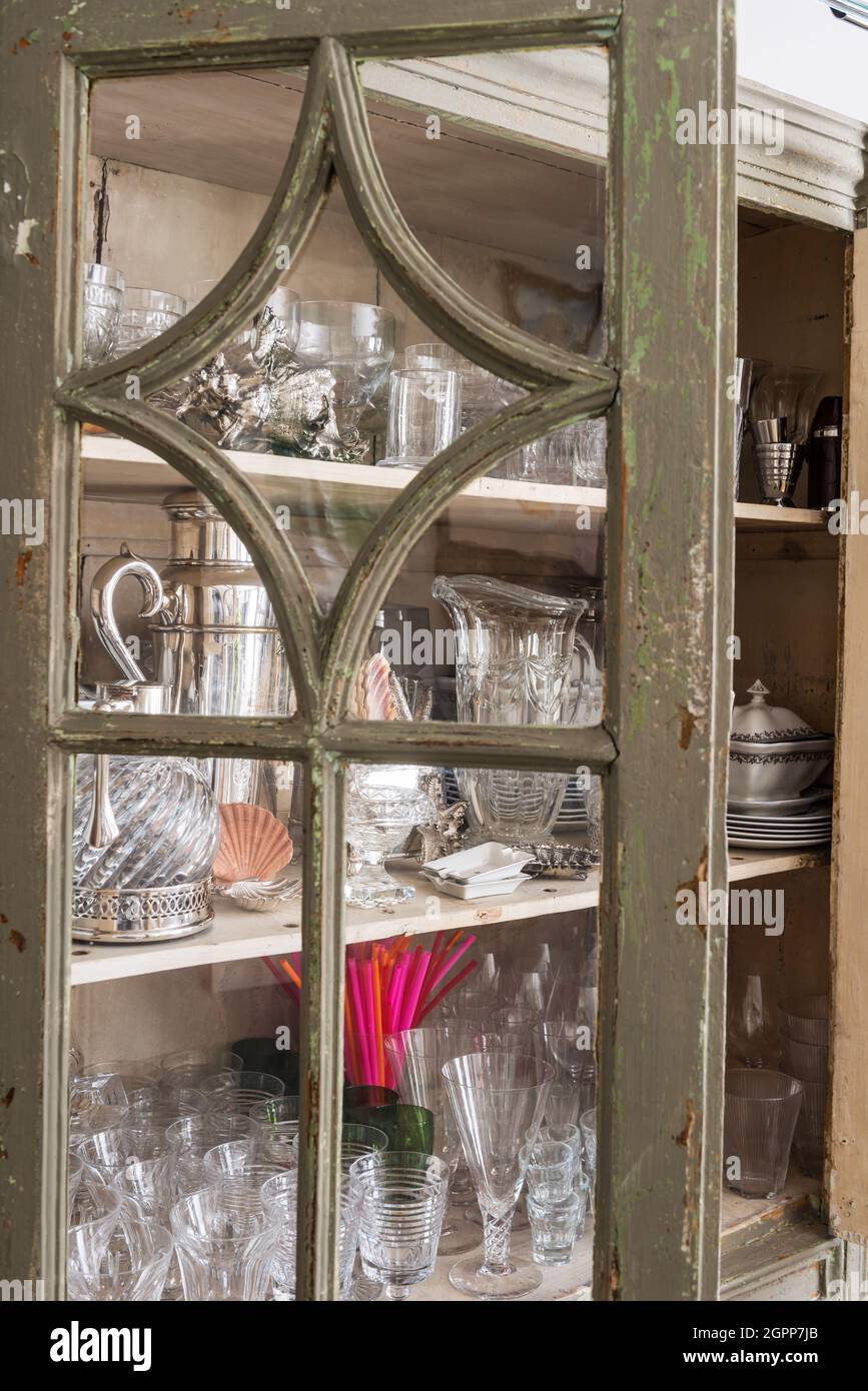 Collection of antique glassware in London townhouse Stock Photo - Alamy