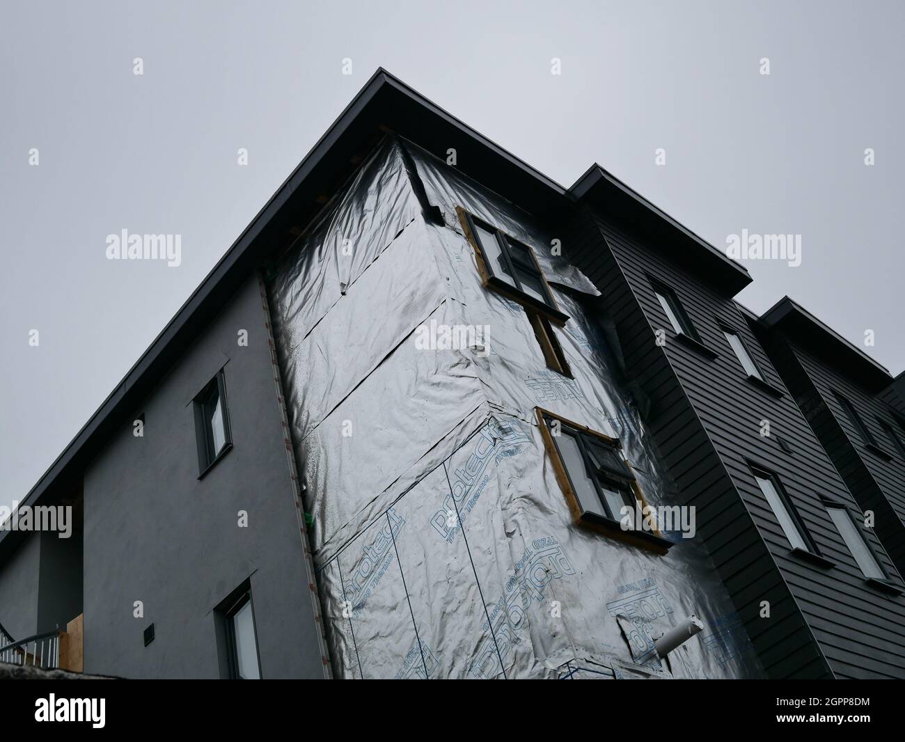 Insulation, exterior render and cladding construction elements visible ...